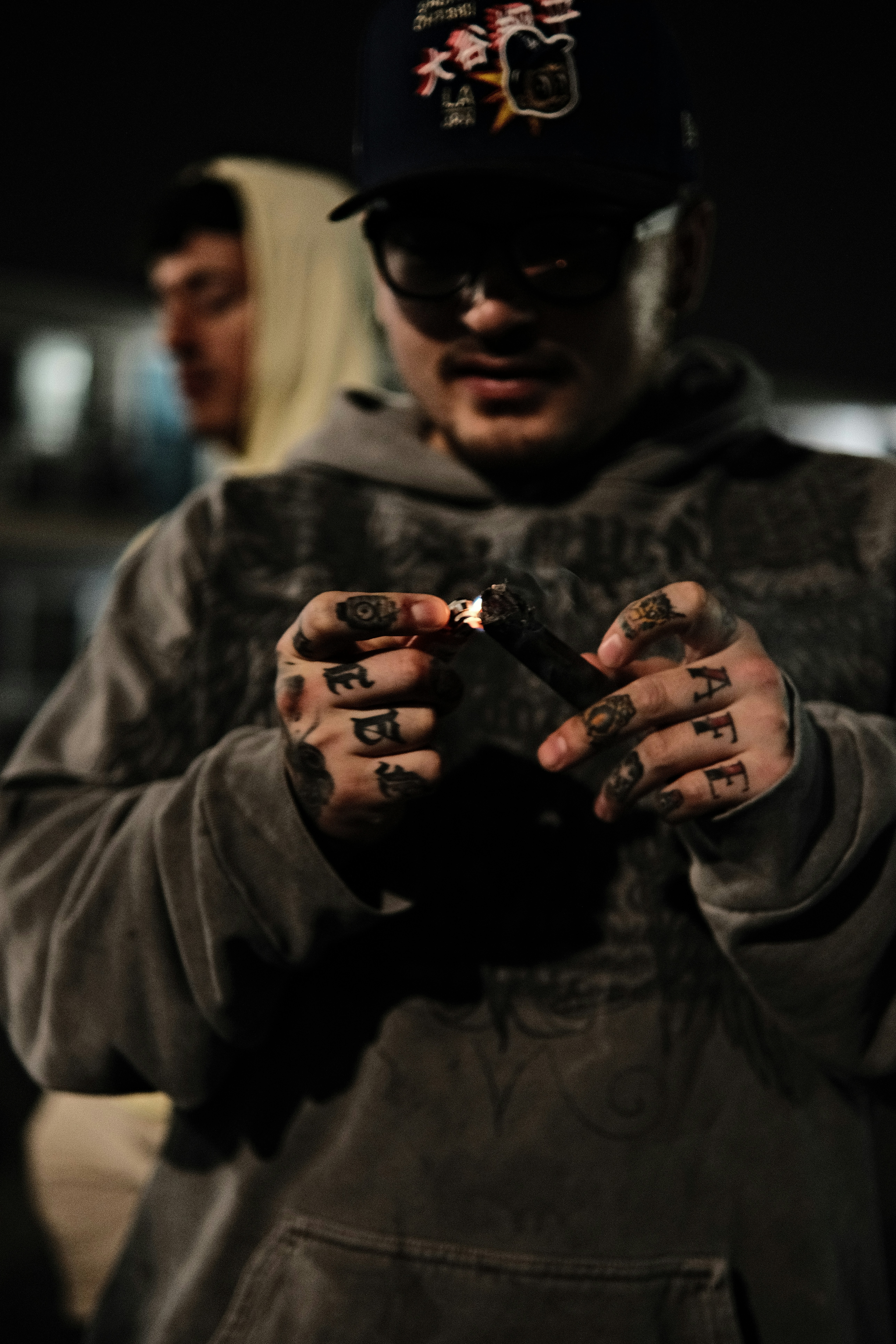Smoking in the Shadow: Hands and Torch in a Quiet Moment