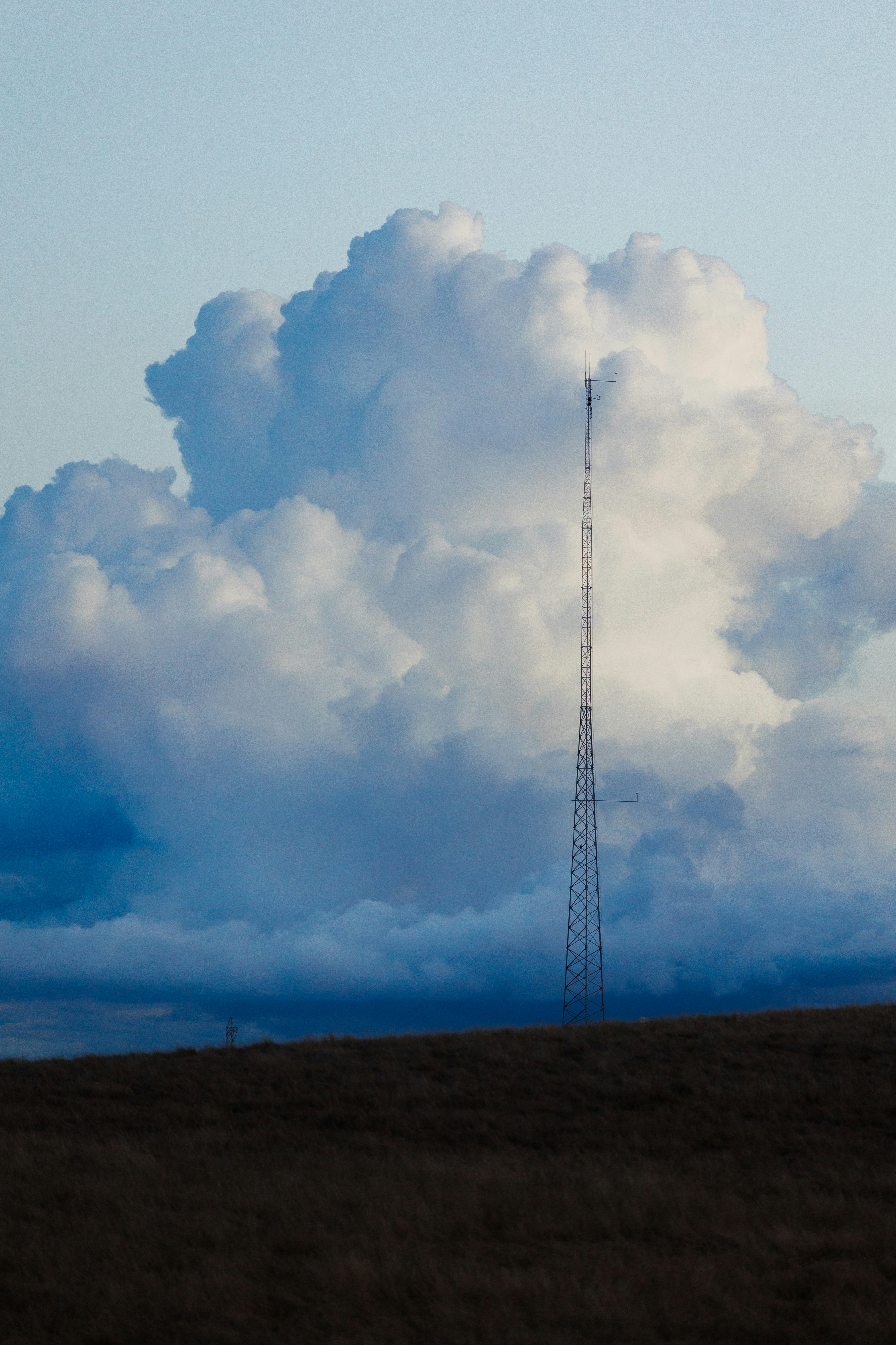 Tall Mast Against Cloud Cathedral