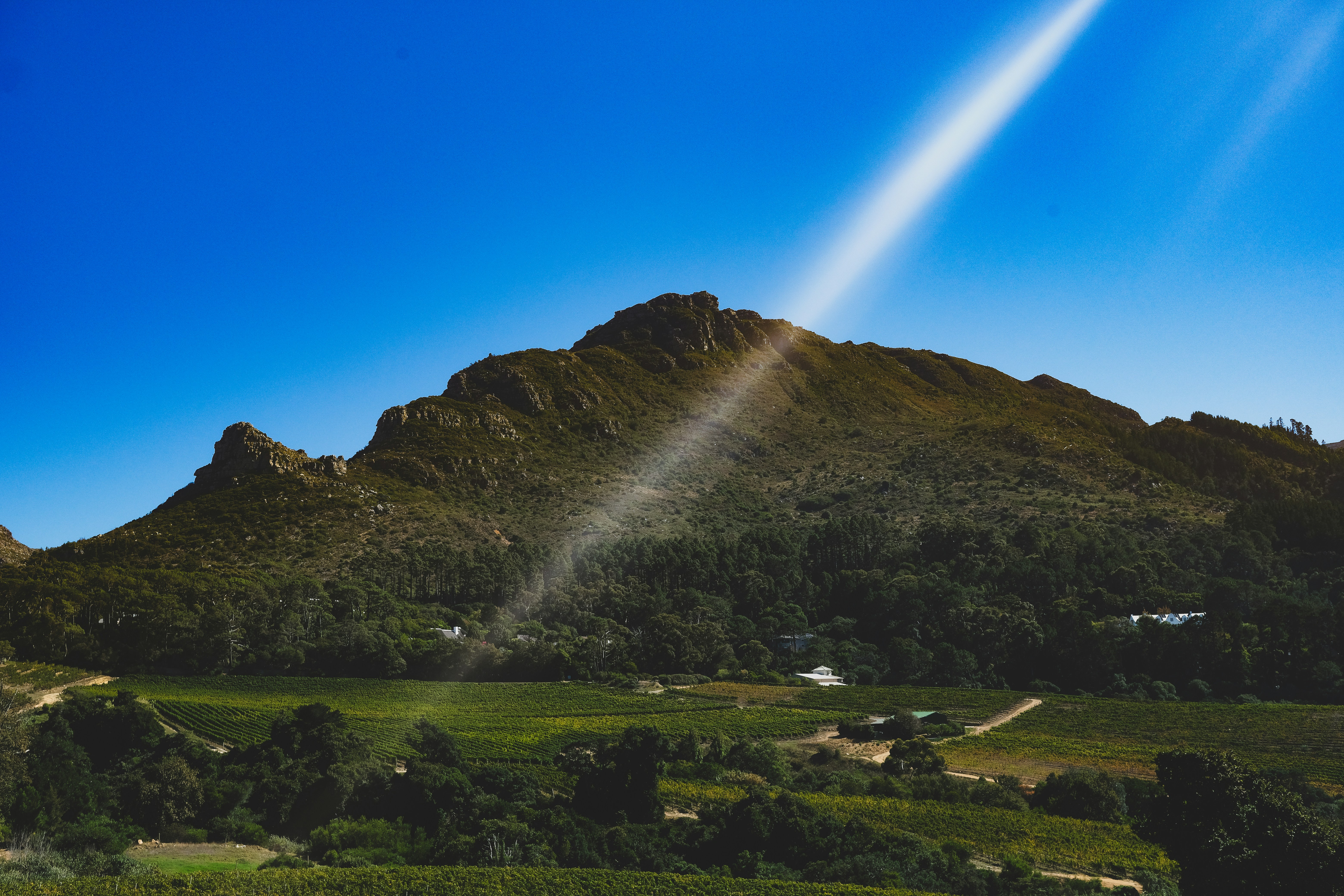 Sunlit Summit Above Green Terraces