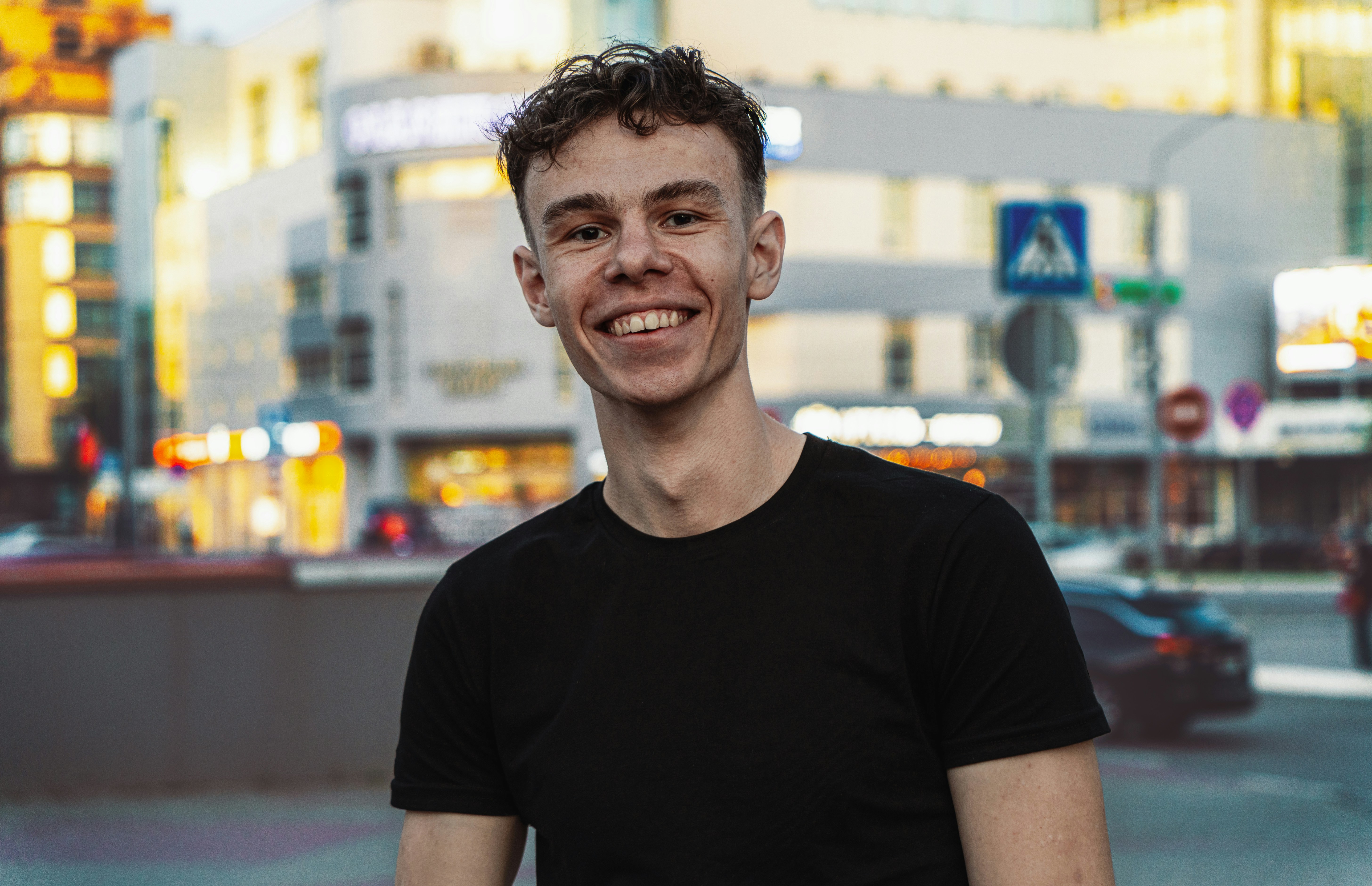 Smiling Portrait in a Sunlit Urban Quietude