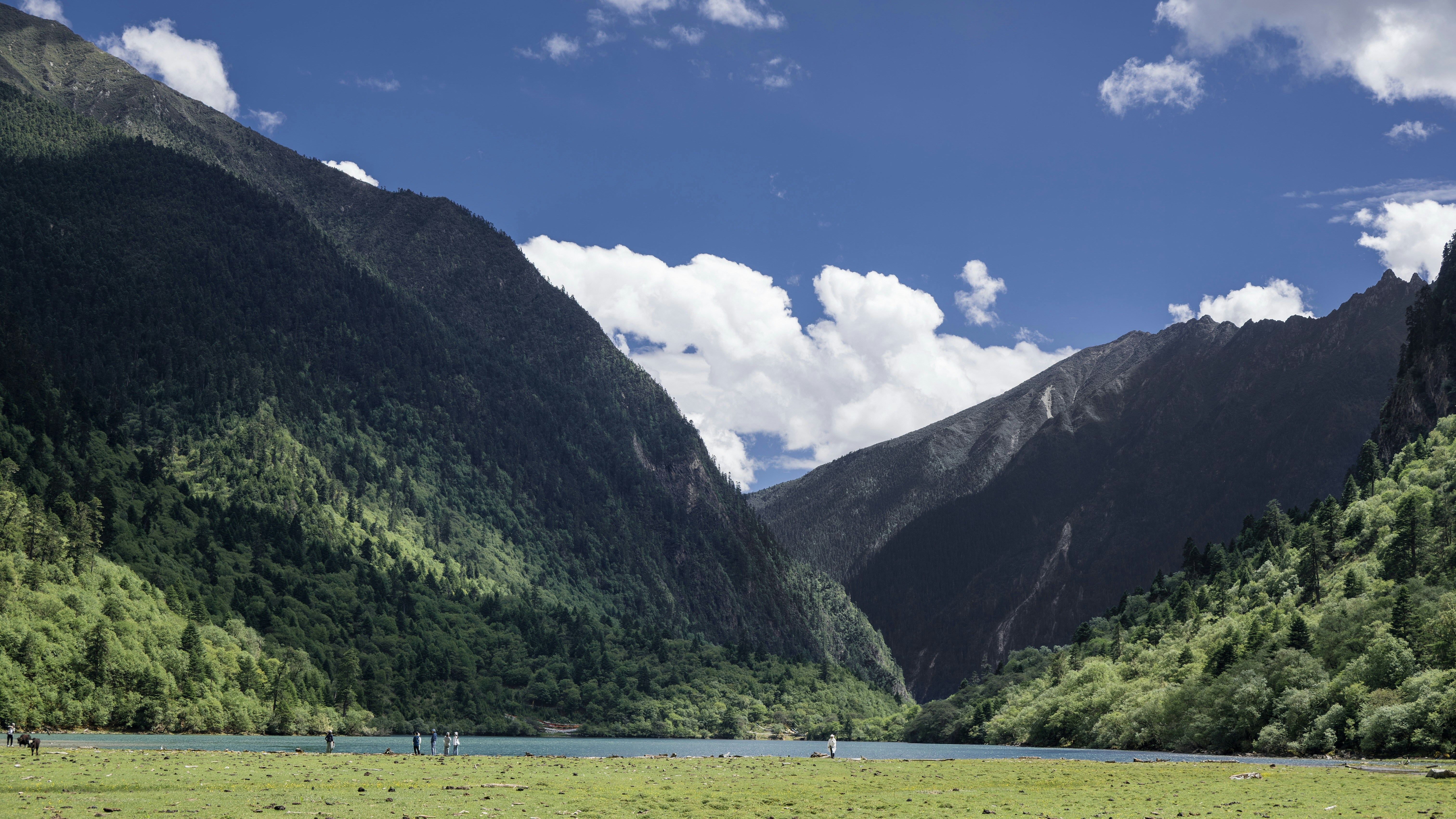 Vast Alpine Fjord: Sunlit Peaks Framing a Quiet Lake