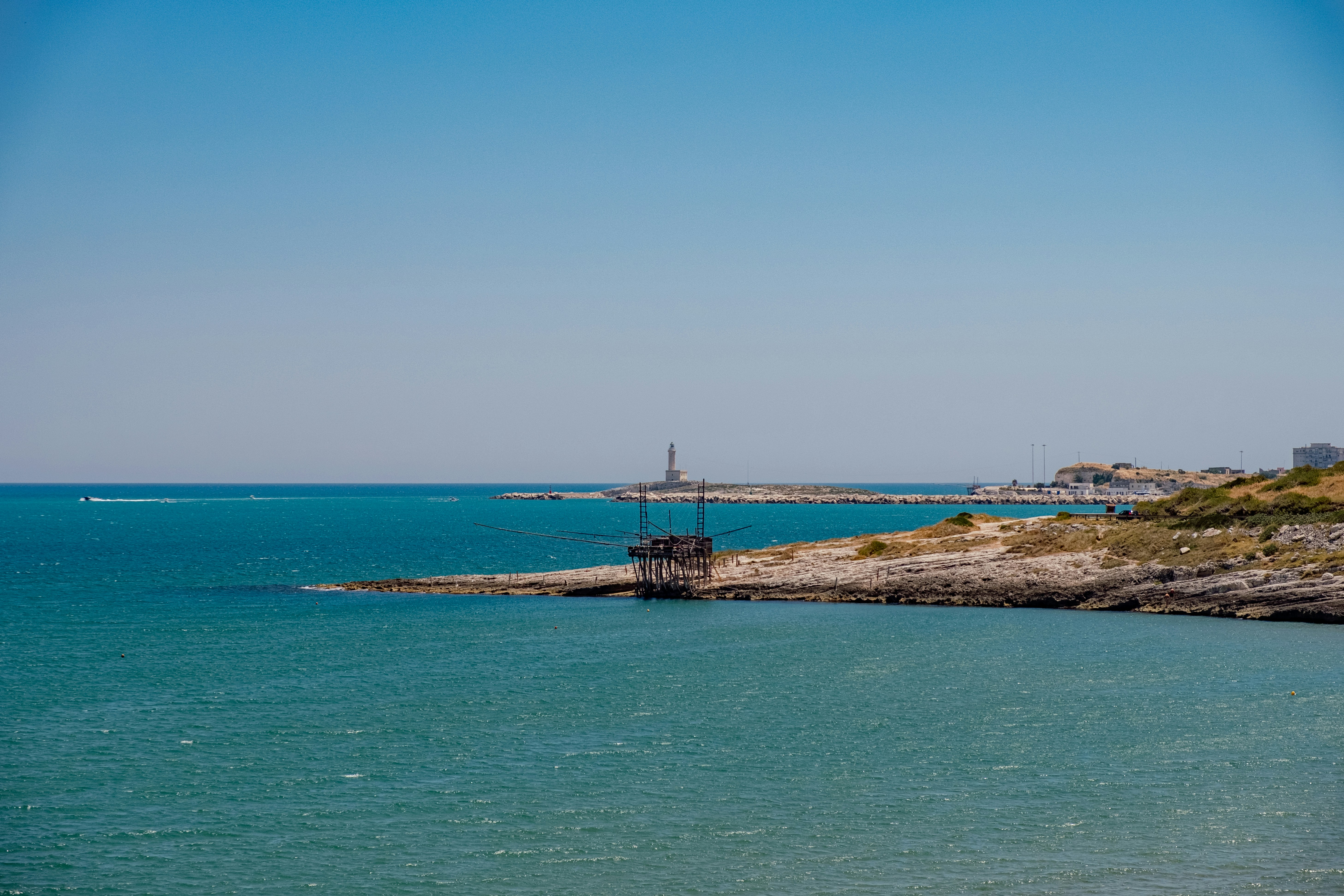 Coastal Horizon: A Quiet Outpost by the Turquoise Sea