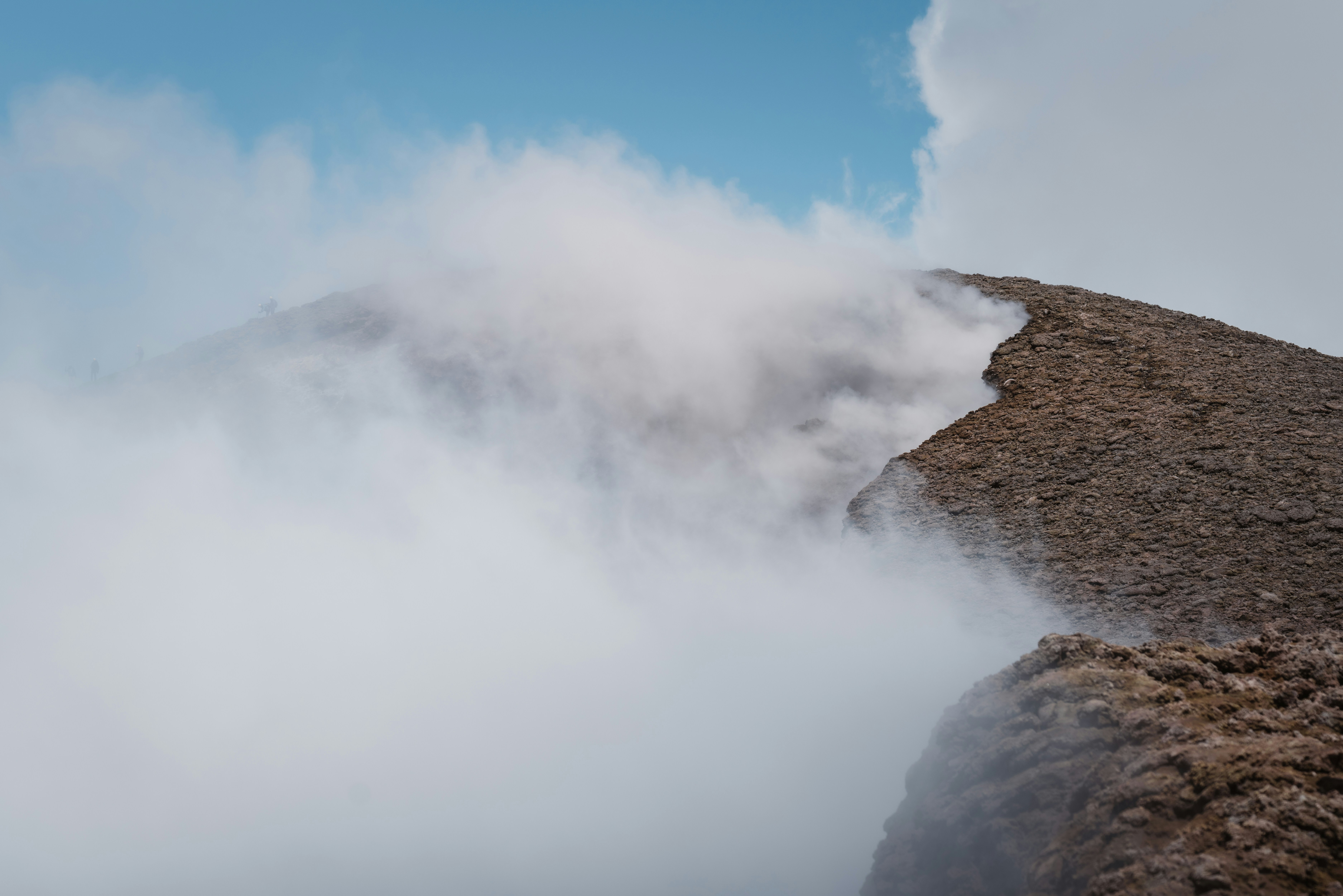 Ridgeveil: Cloudy Summit Breaking Over Jagged Rock