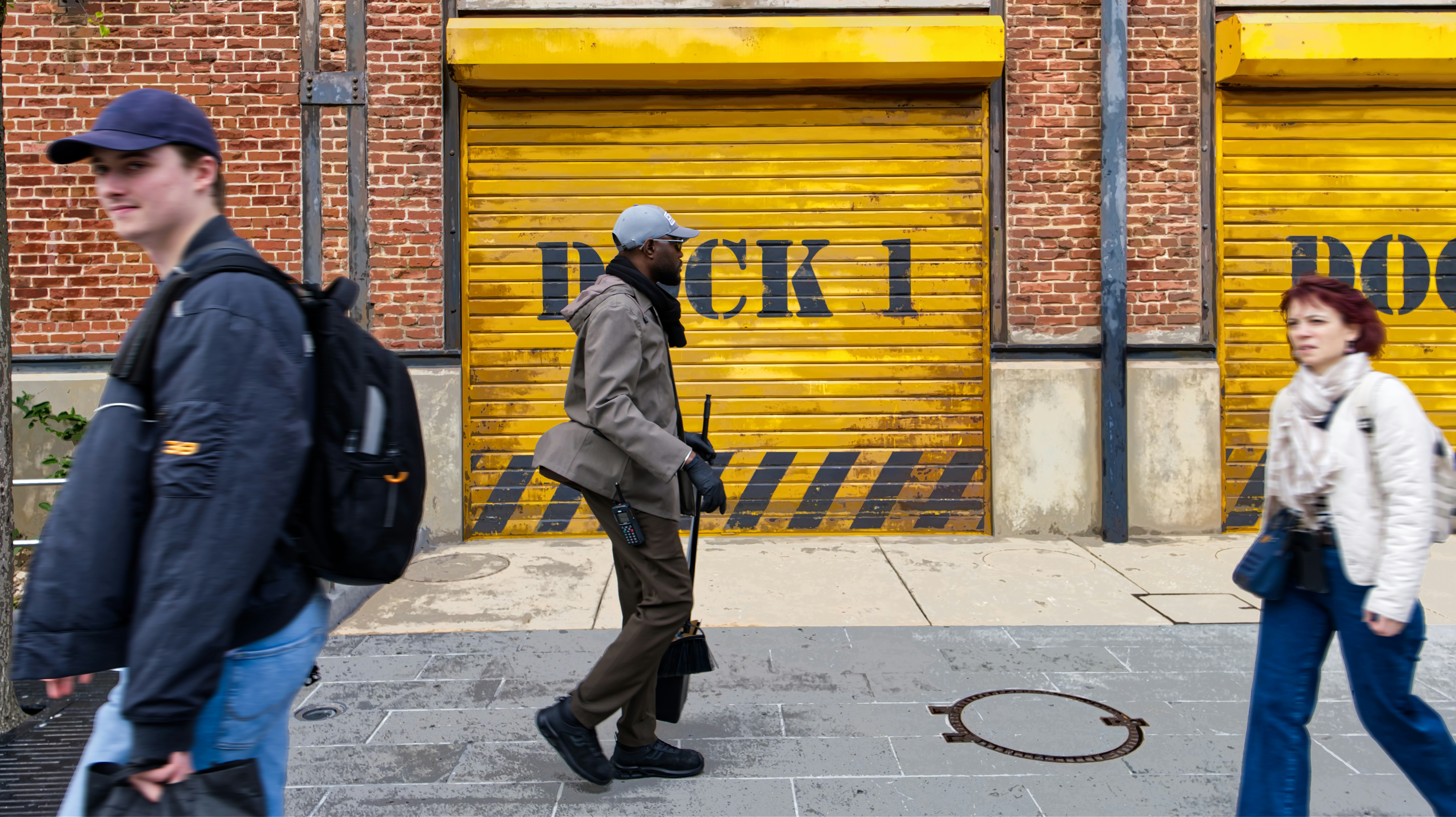 Stride and Silence: A City Walk in Front of Closed Yellow Doors