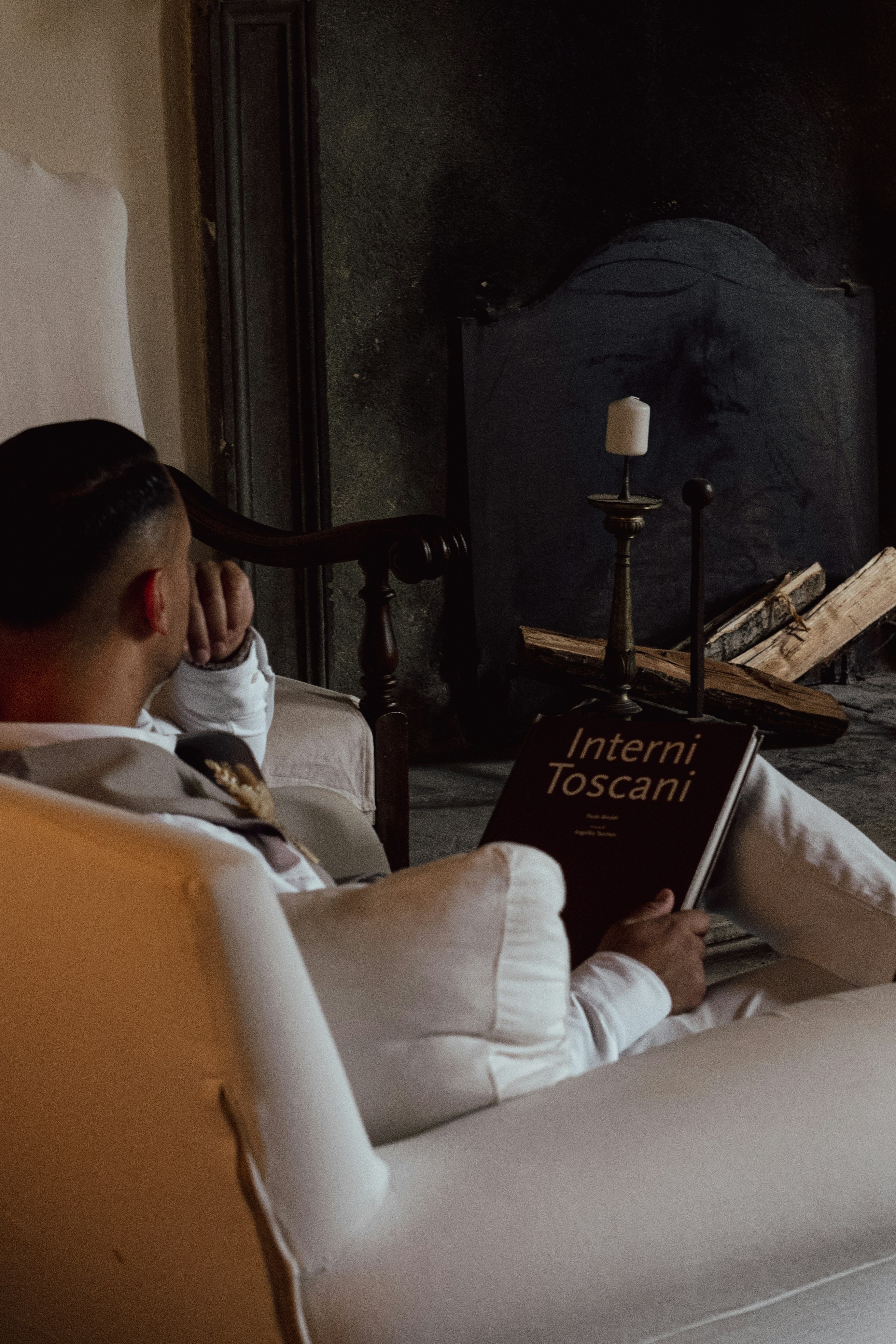 Quiet Reading by the Fireplace: A Soldier Reclines with a Book
