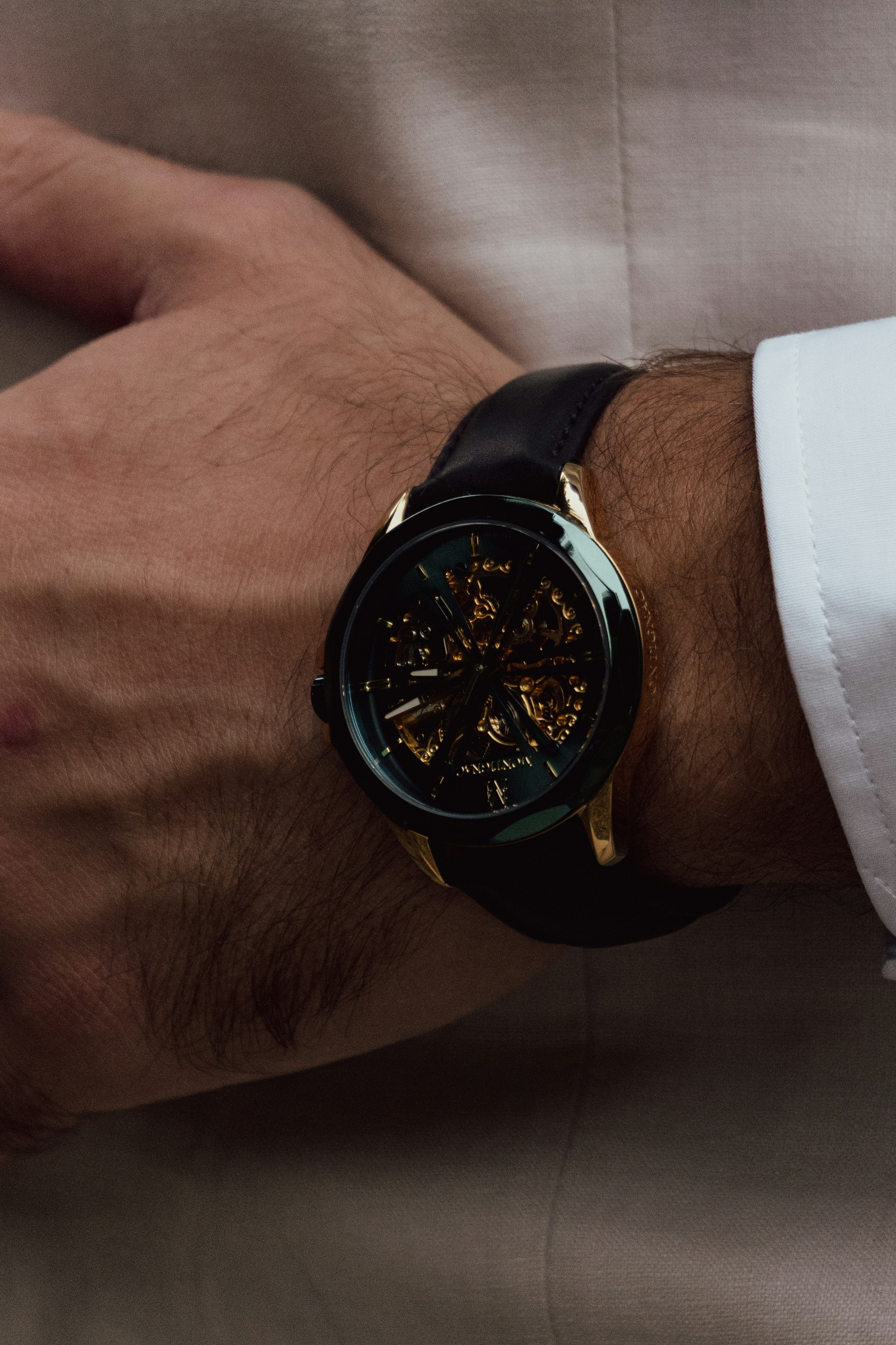 Golden Skeleton at Rest: A Luxury Timepiece Graces a Gentle Wrist