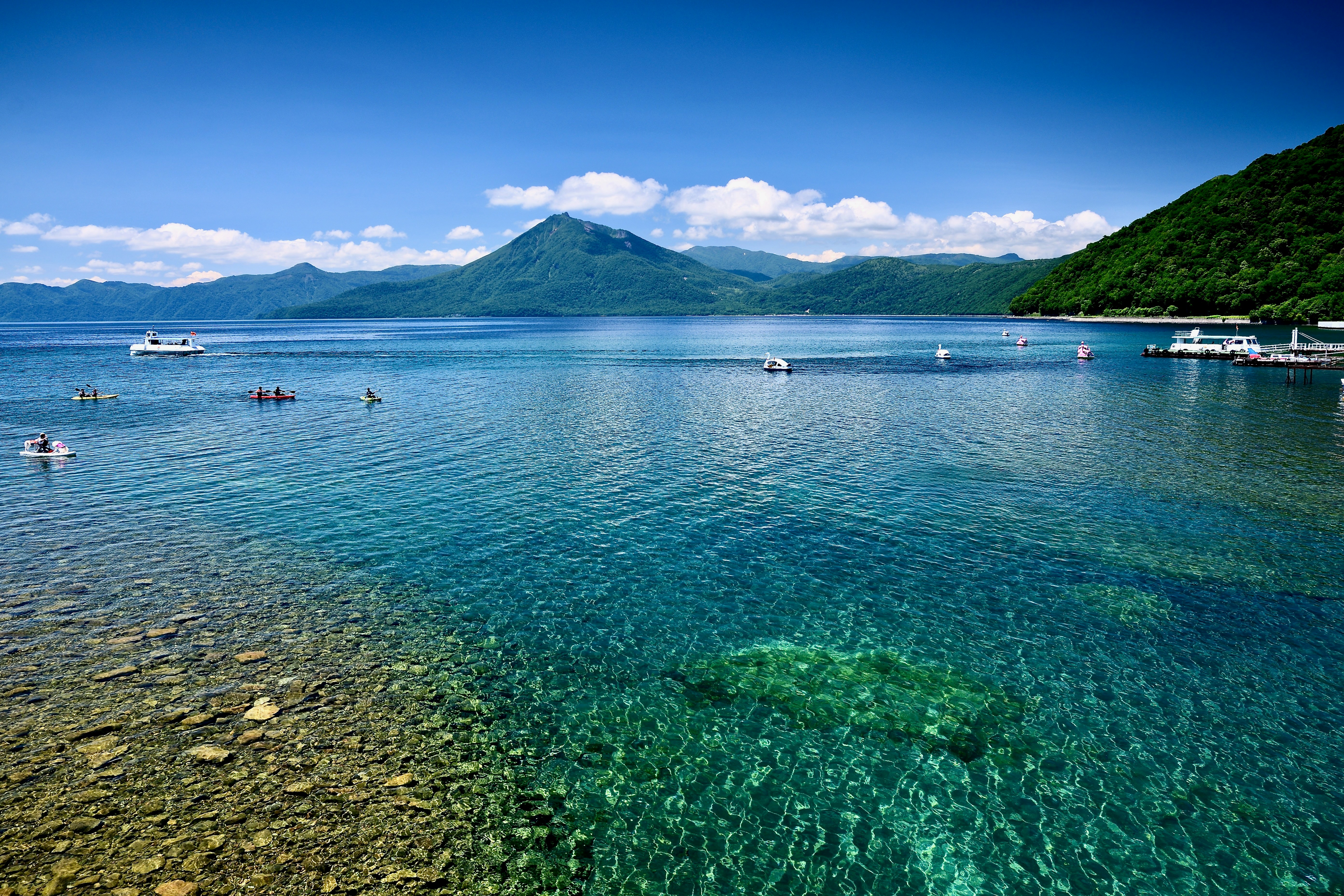 Crystal Harbor: A Glassy Bay Framed by Green Peaks