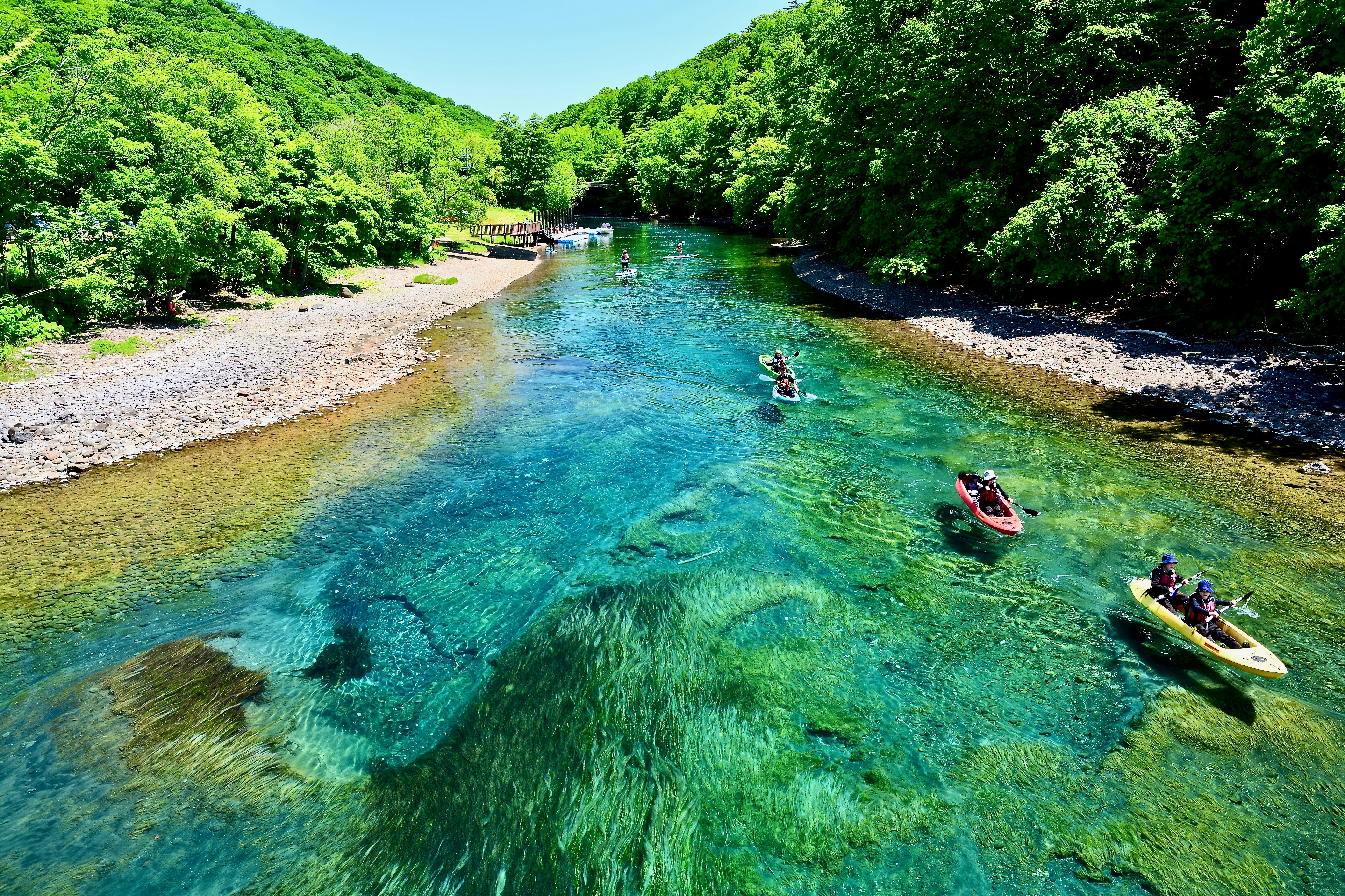 Emerald River Run: Kayaks Thread a Glassy Gorge
