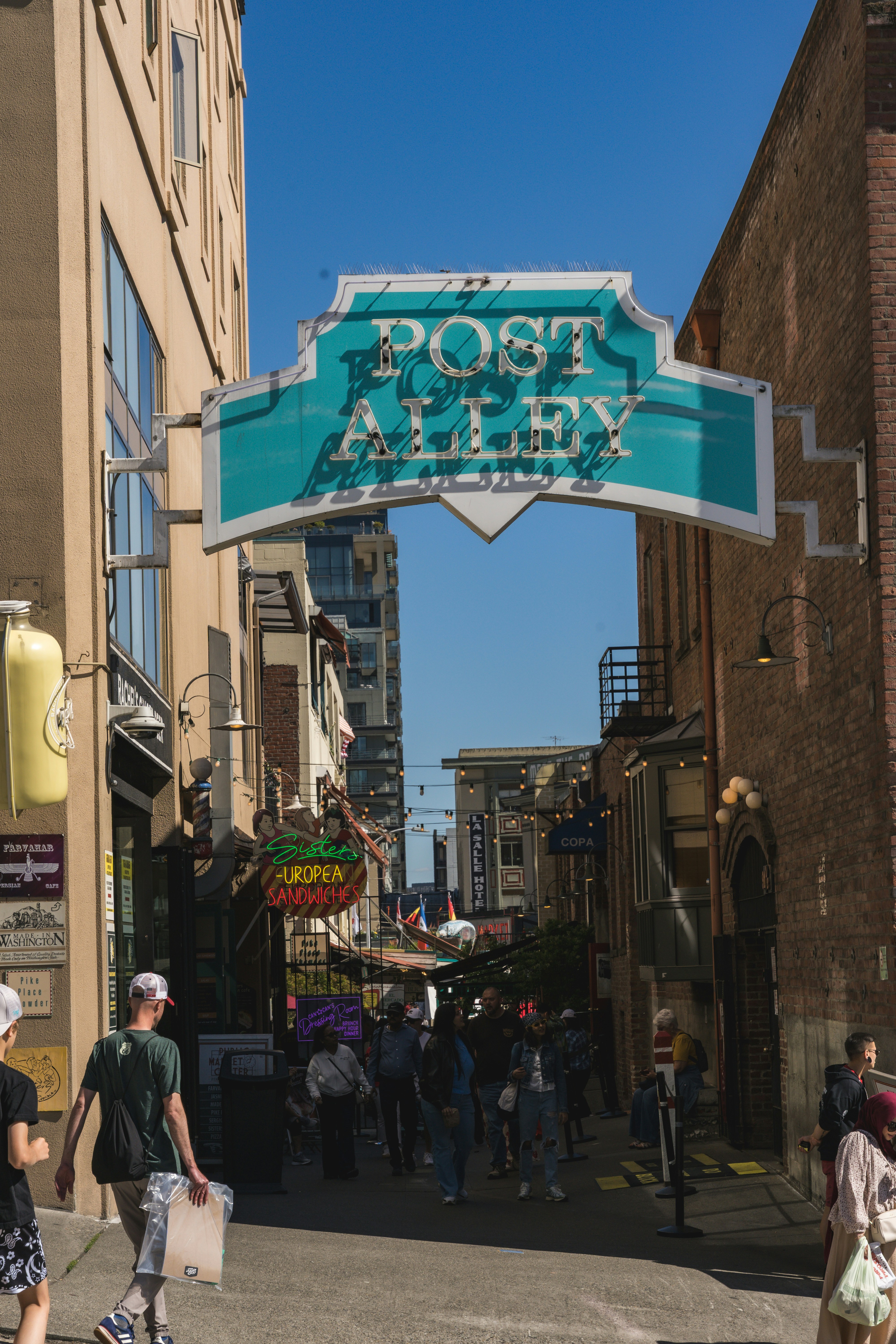 Green Signway: The Post Alley Arch Over a Busy Pedestrian Lane