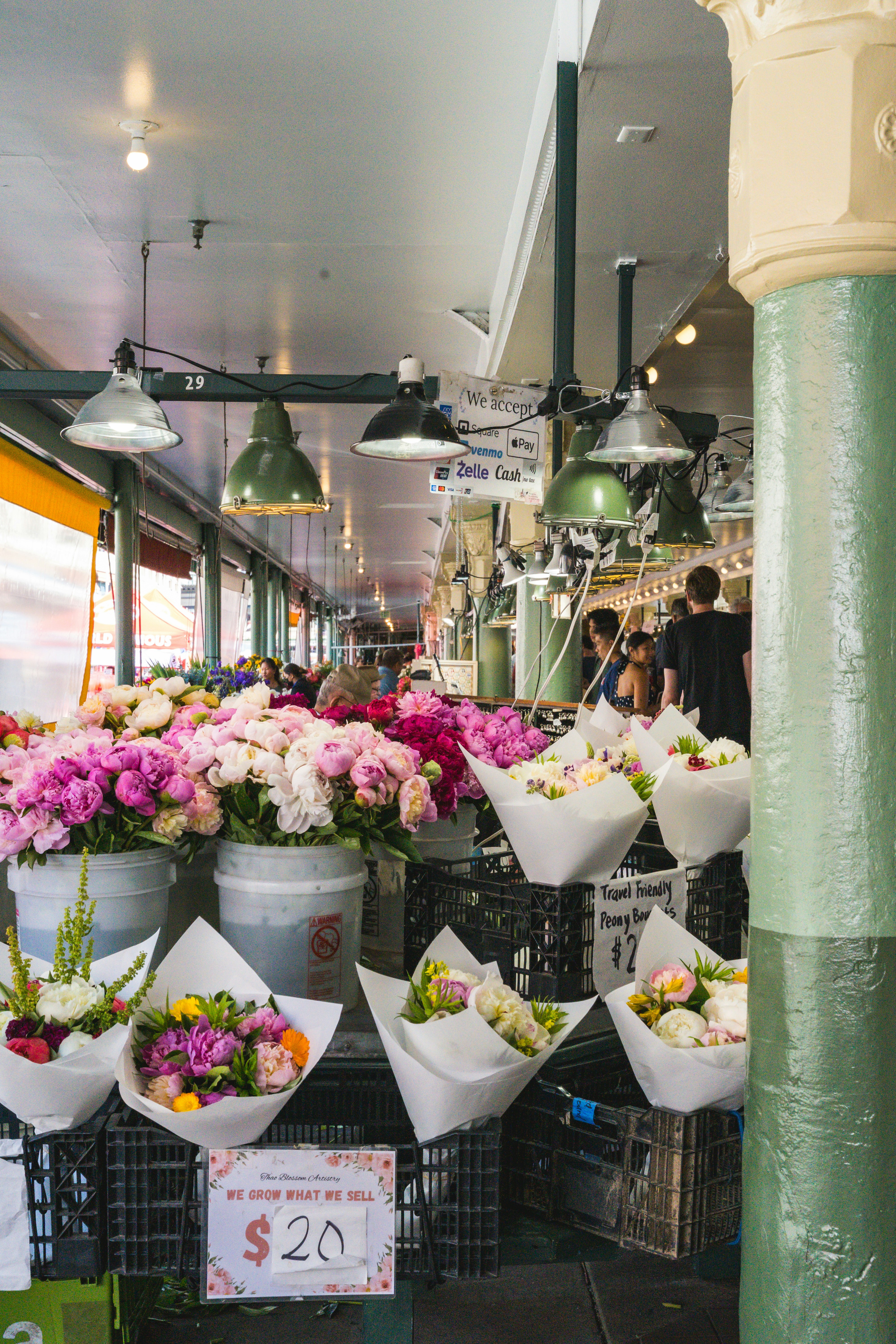 A Market Corridor of Blooms: Flowers Framing the Food Hall
