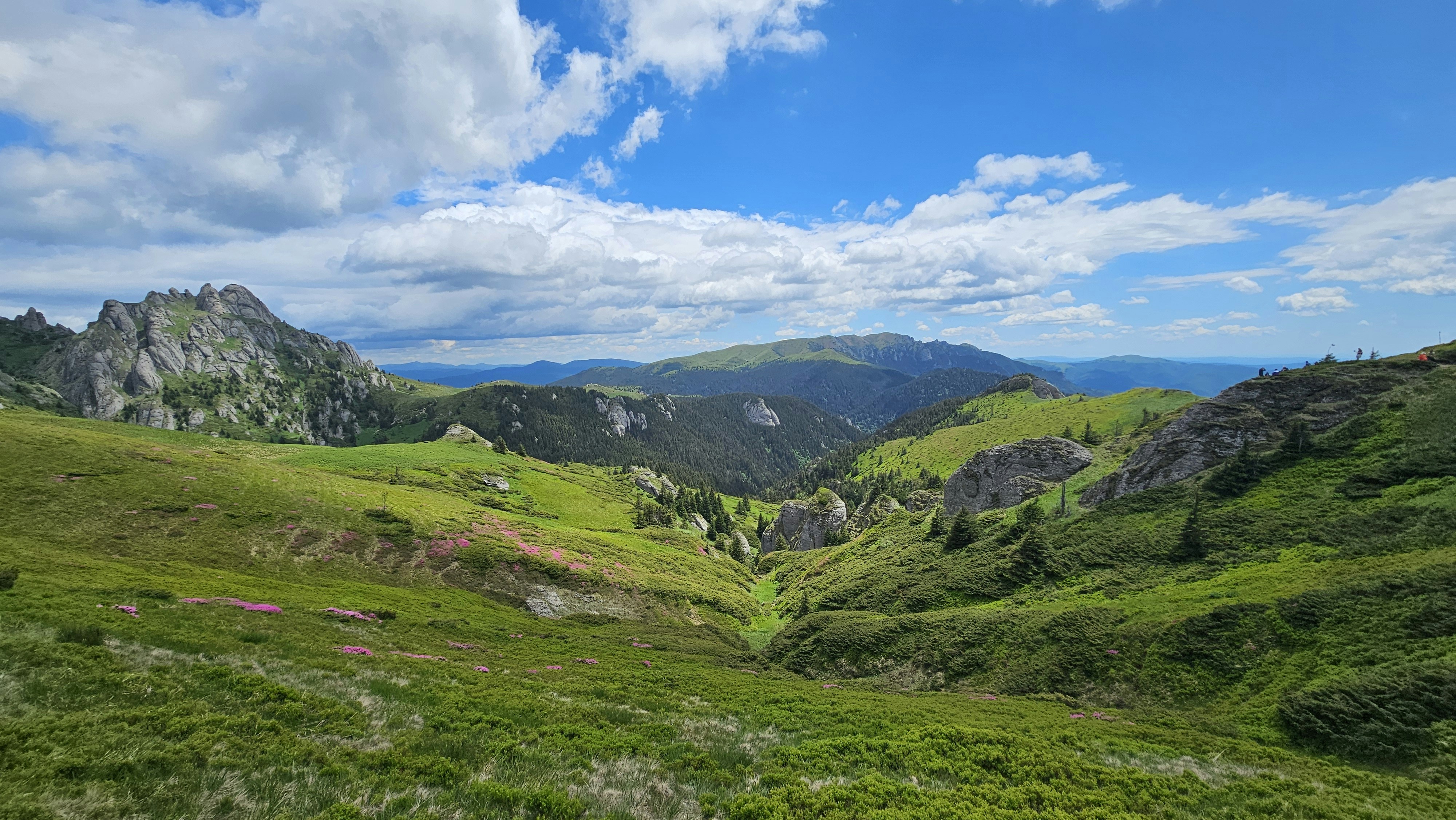 Valley Crest Under a Blue Slice: Carved Terrain and Open Sky