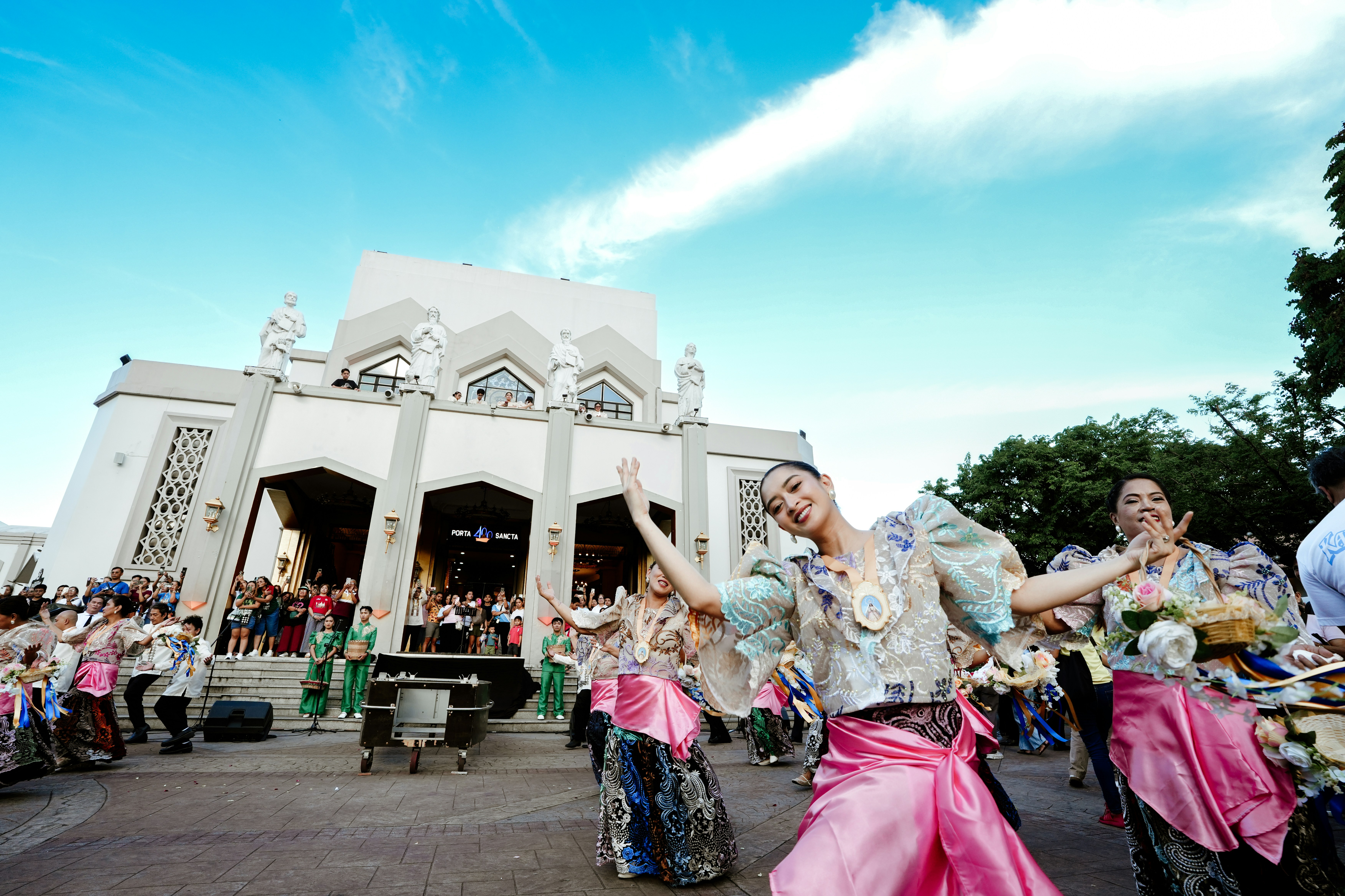 Dance in the Courtyard: Colorful Performers Rallying the Crowd