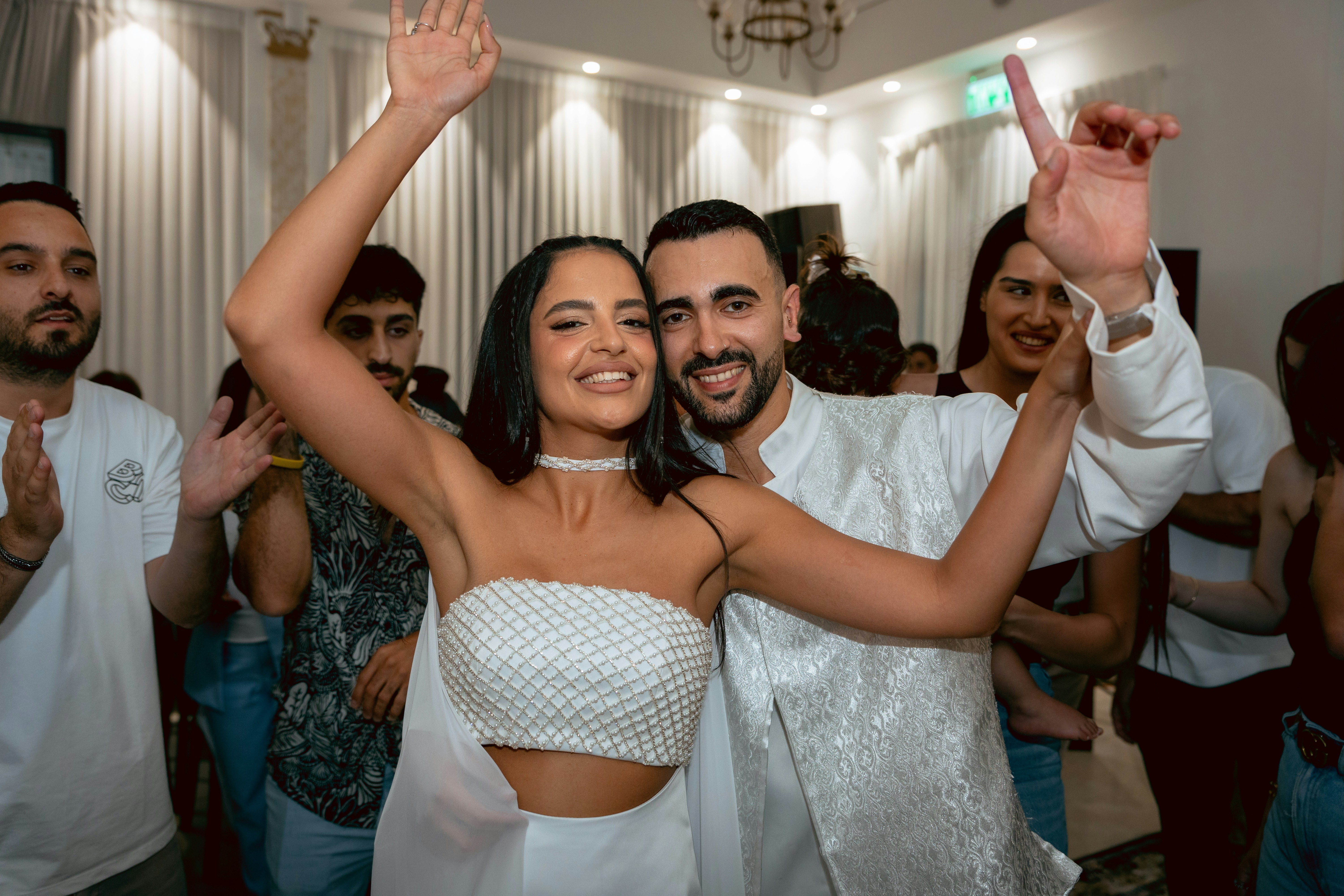 Joyful Dance Duo: A Bride and Groom Share the Spotlight