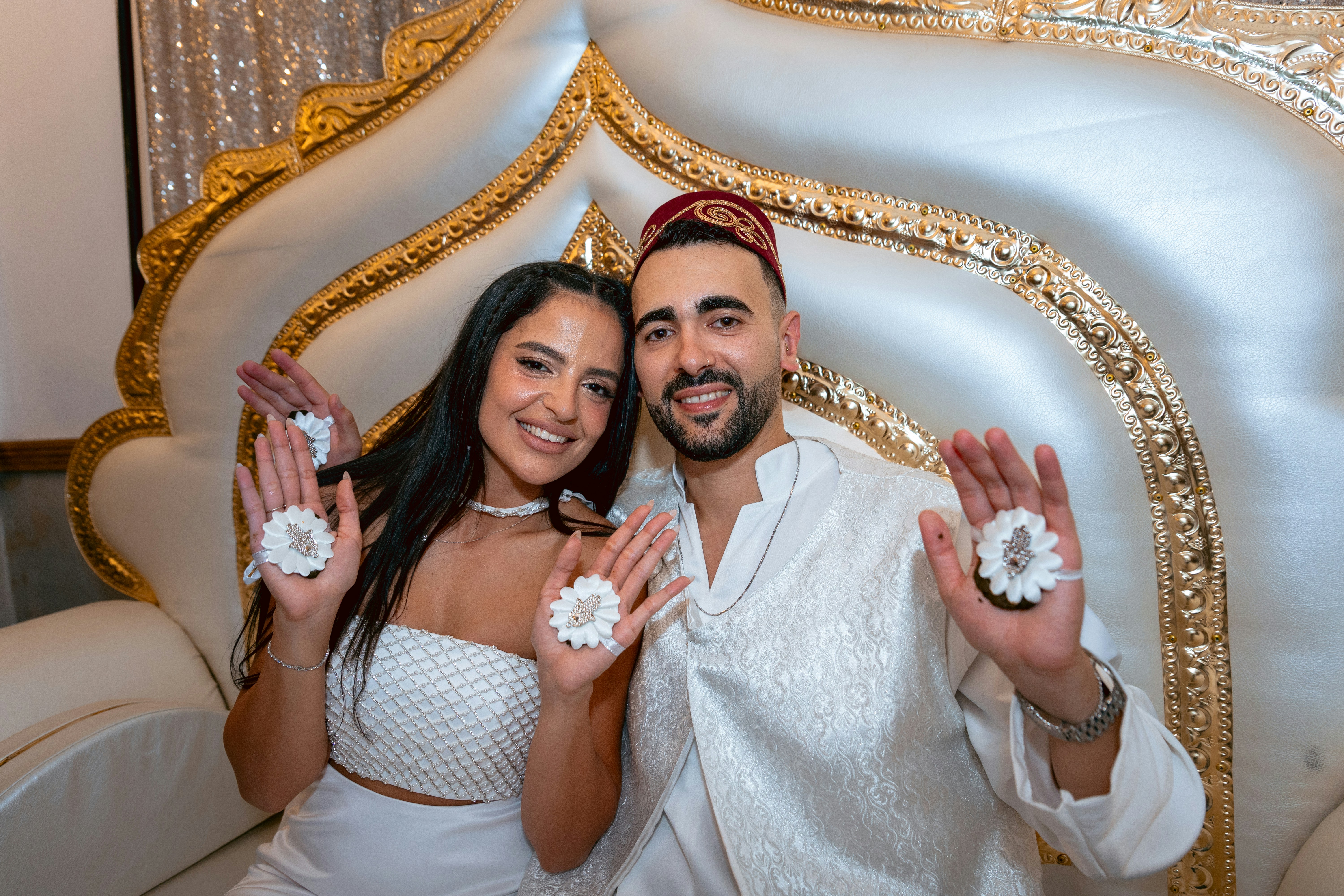 White-tie celebration: a couple showcases jewelry against an ornate backdrop