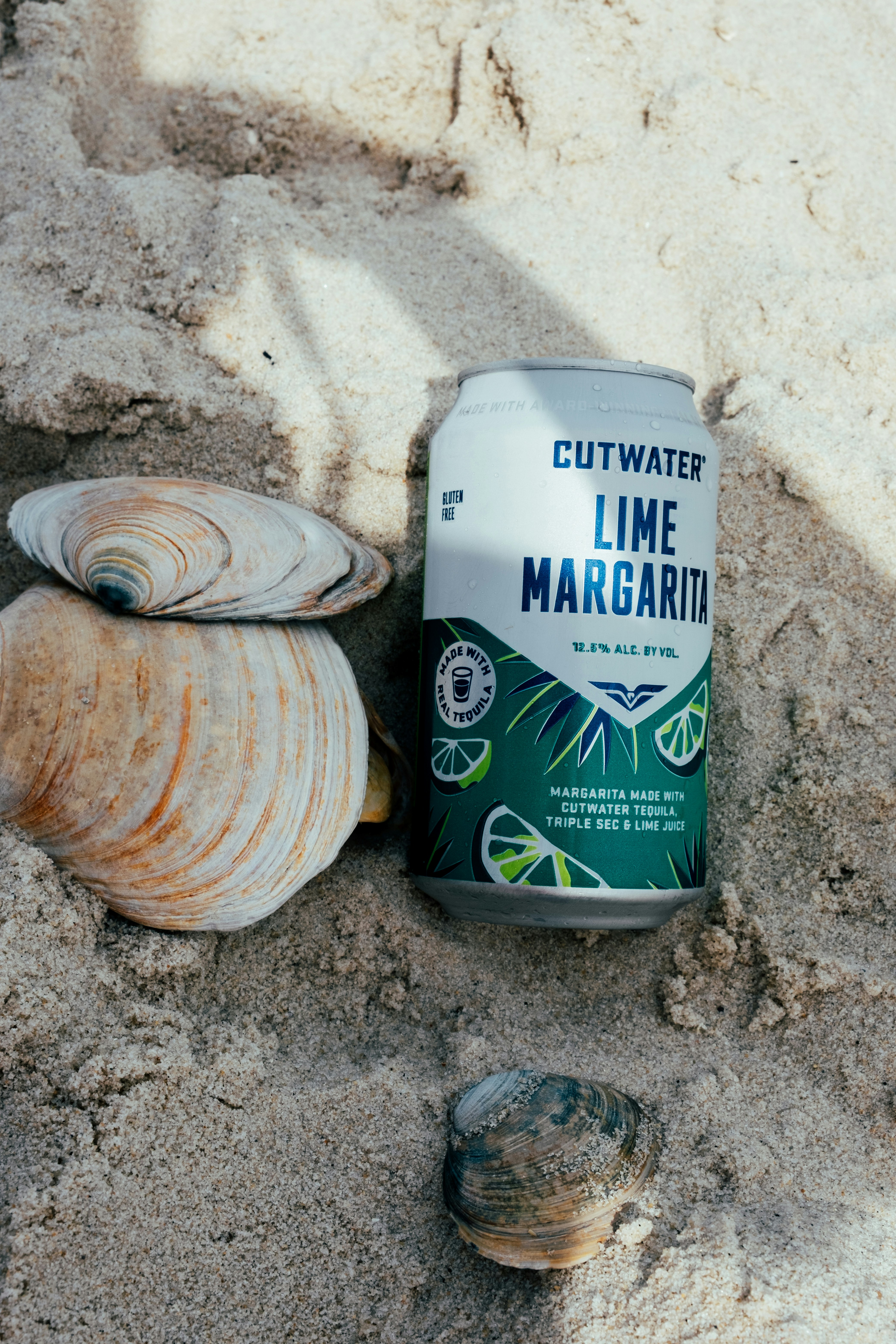 Lime Margarita Can Anchored by Coastal Shells
