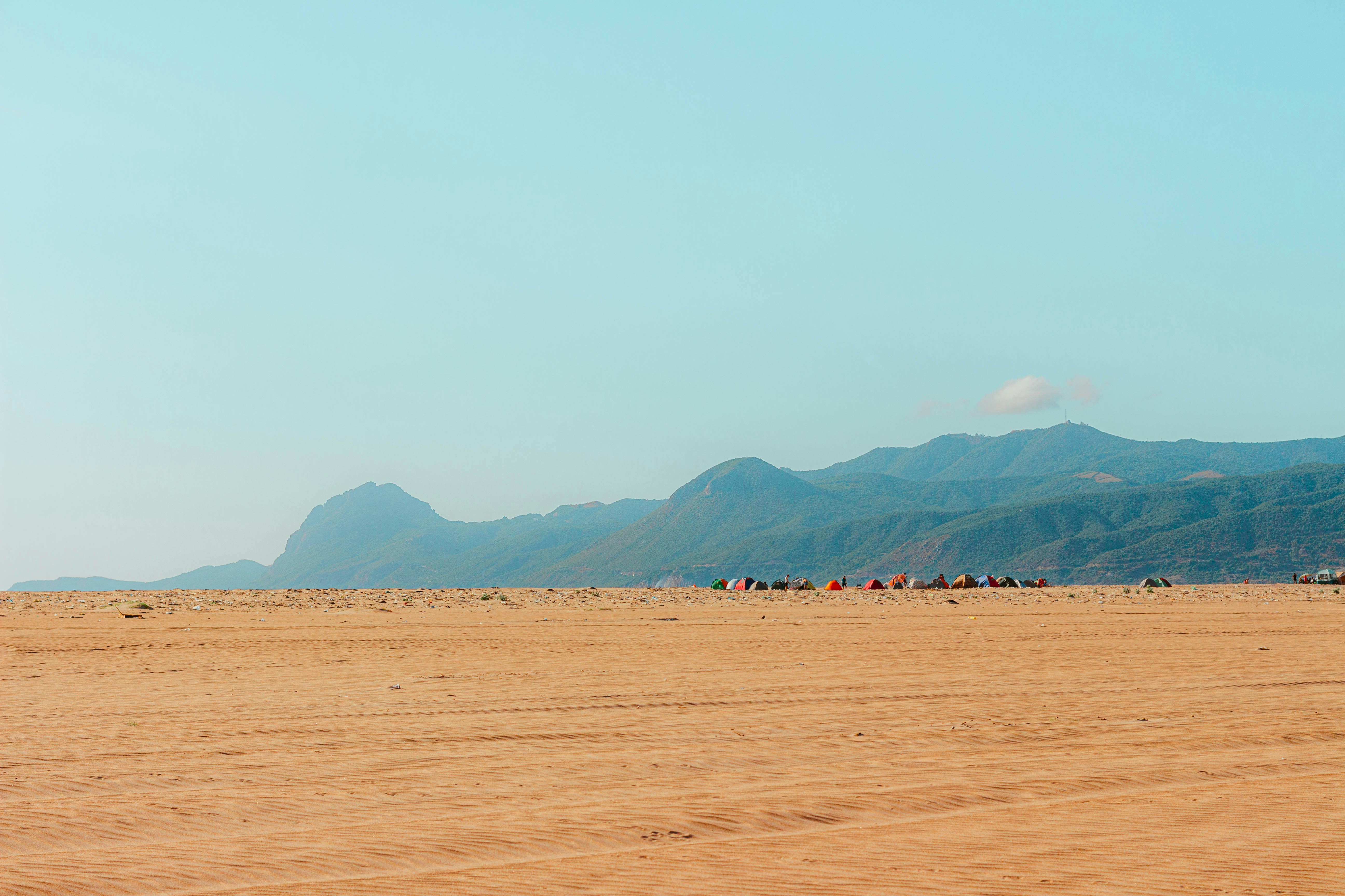 Desert Line: A Caravan at the Edge of Distant Mountains