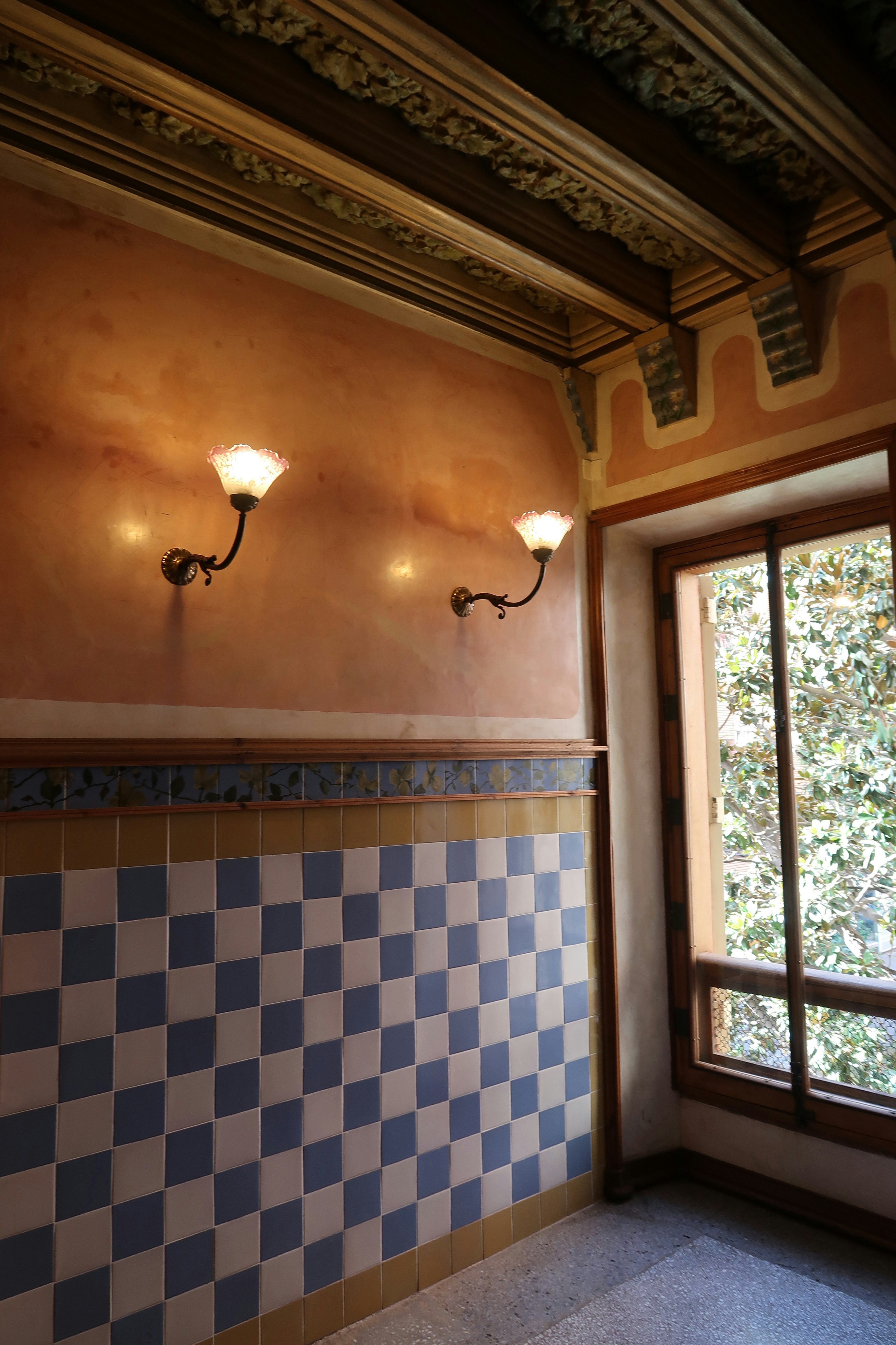 Warm Wall Sconces and Tiled Corridor: A Sunlit Corner of Quiet Architecture