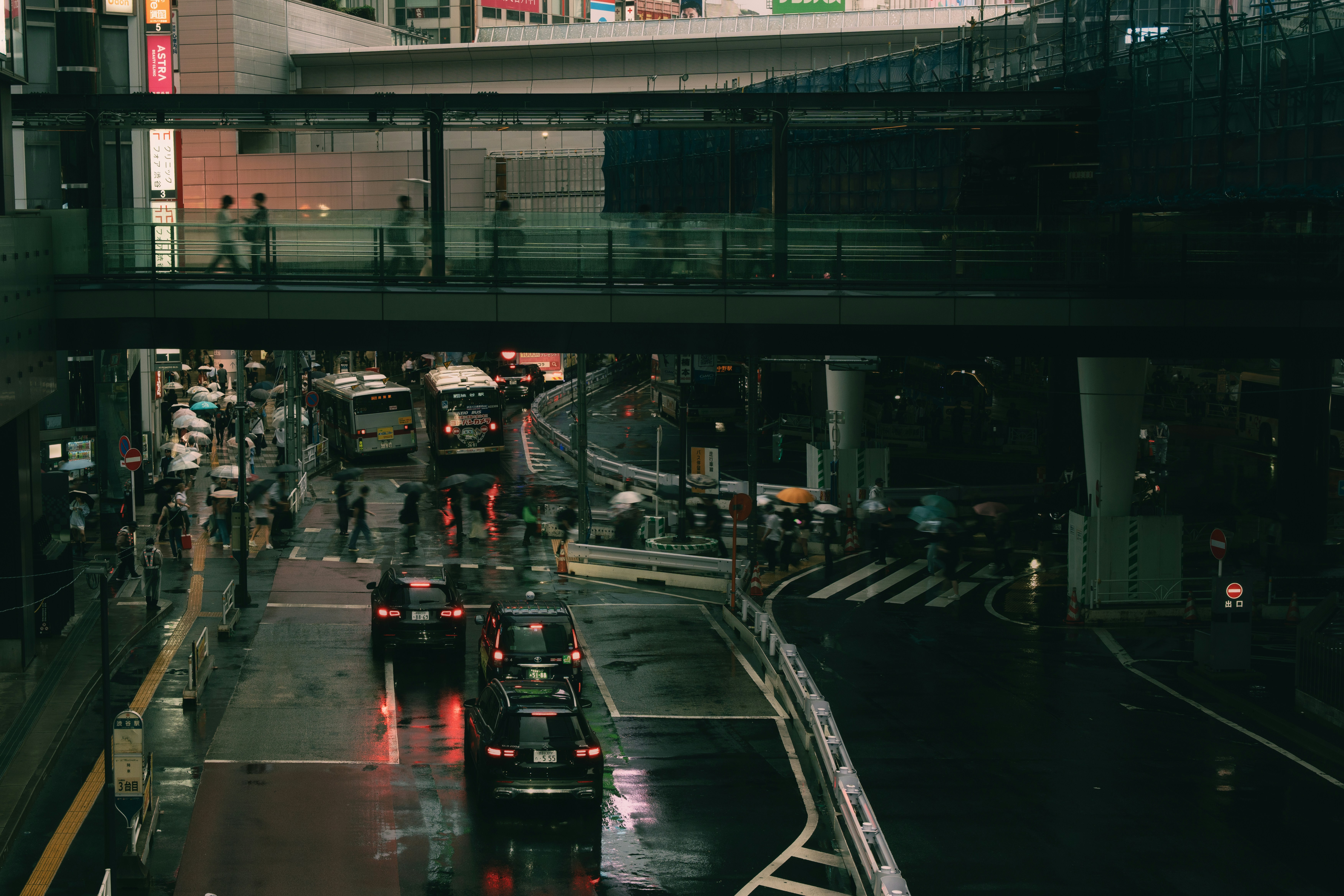 Neon Rain: The City Keeps Moving Under a Wet Overpass
