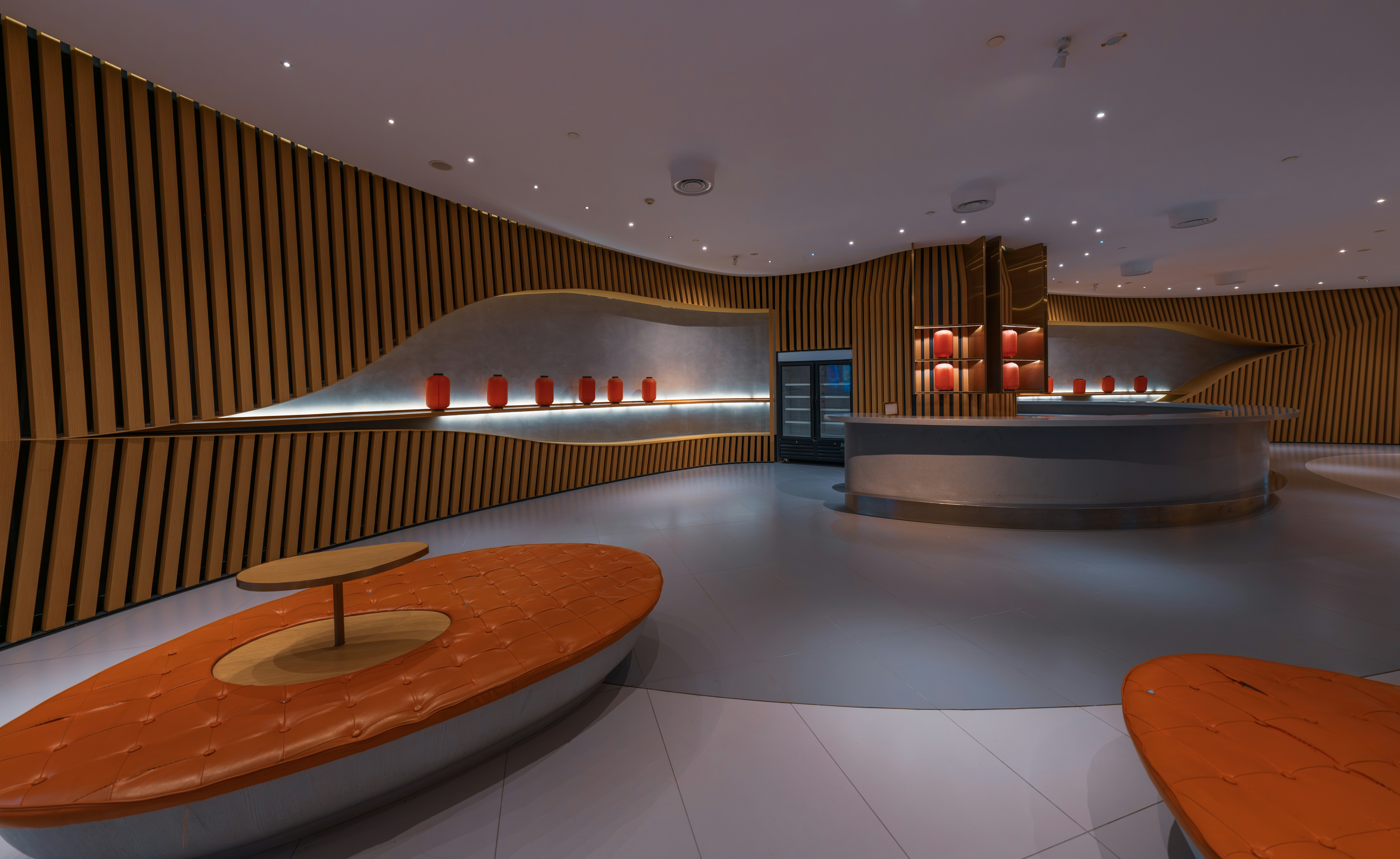 Curved Wood and Velvet Lounge in Subtle Neon Glow