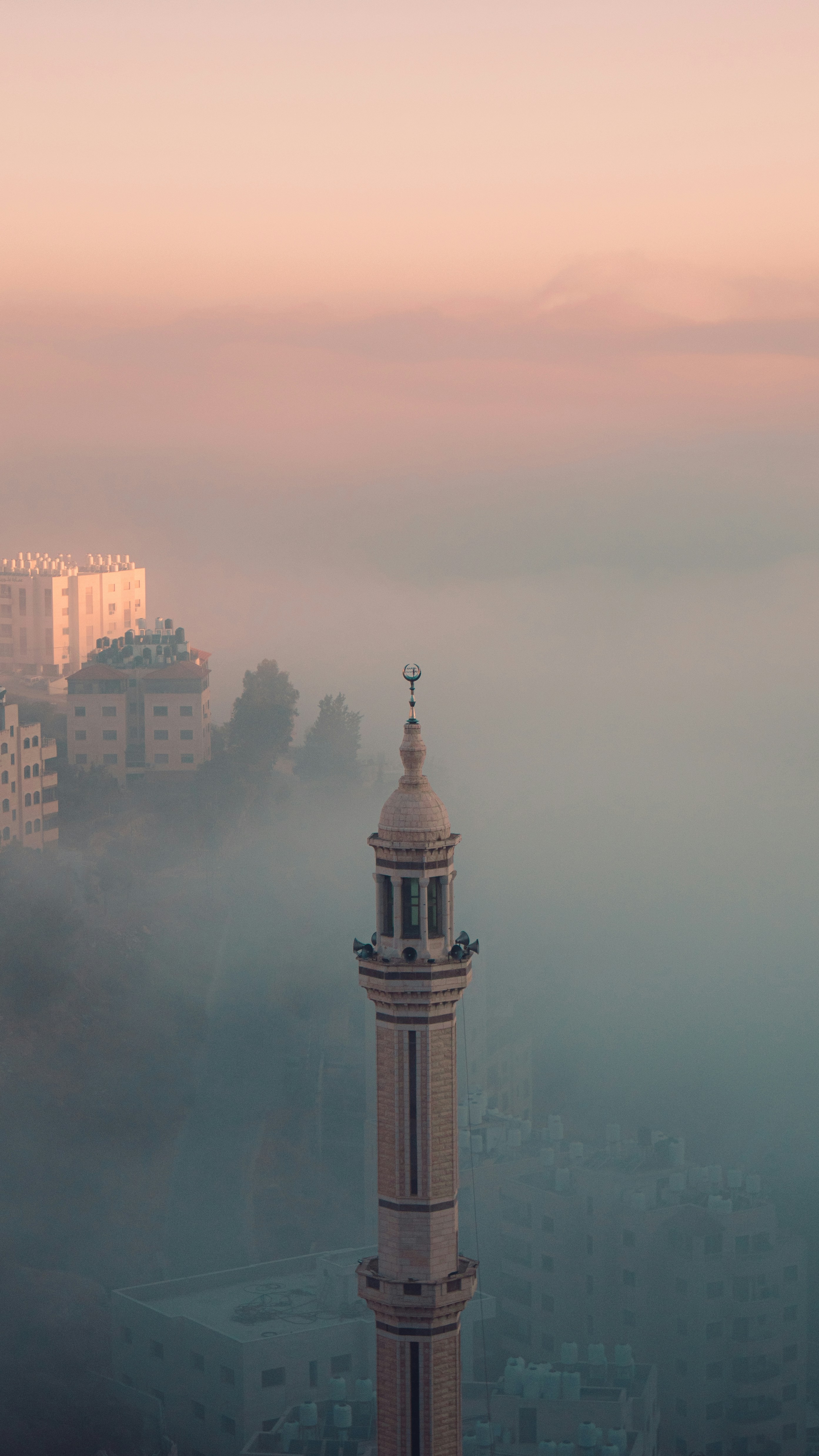 Mist Over a Minaret at Dawn: Calm Towers Vanish into Soft Haze