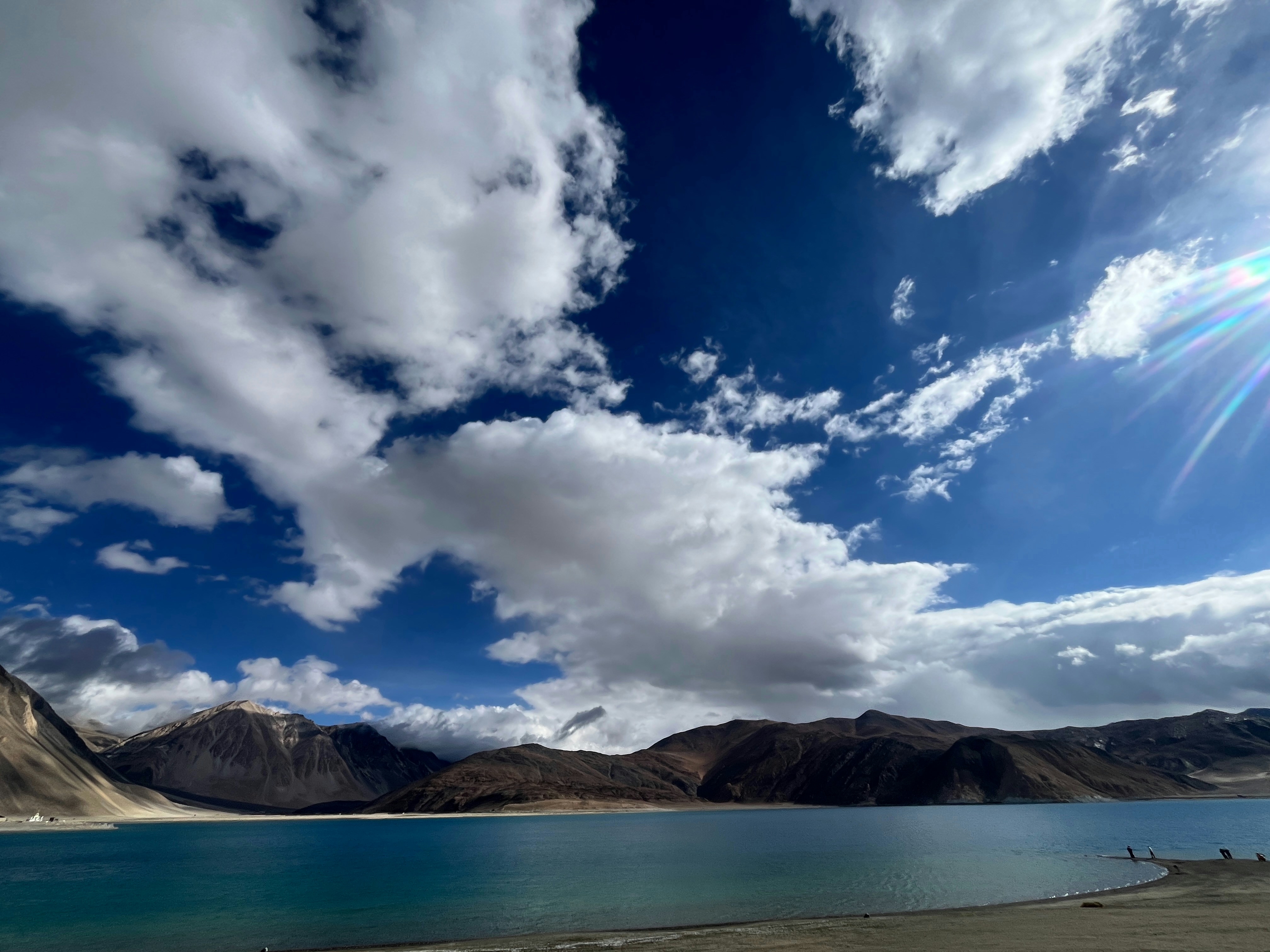 Azure Basin at Noon: A Serenade of Sky, Water, and Peaks