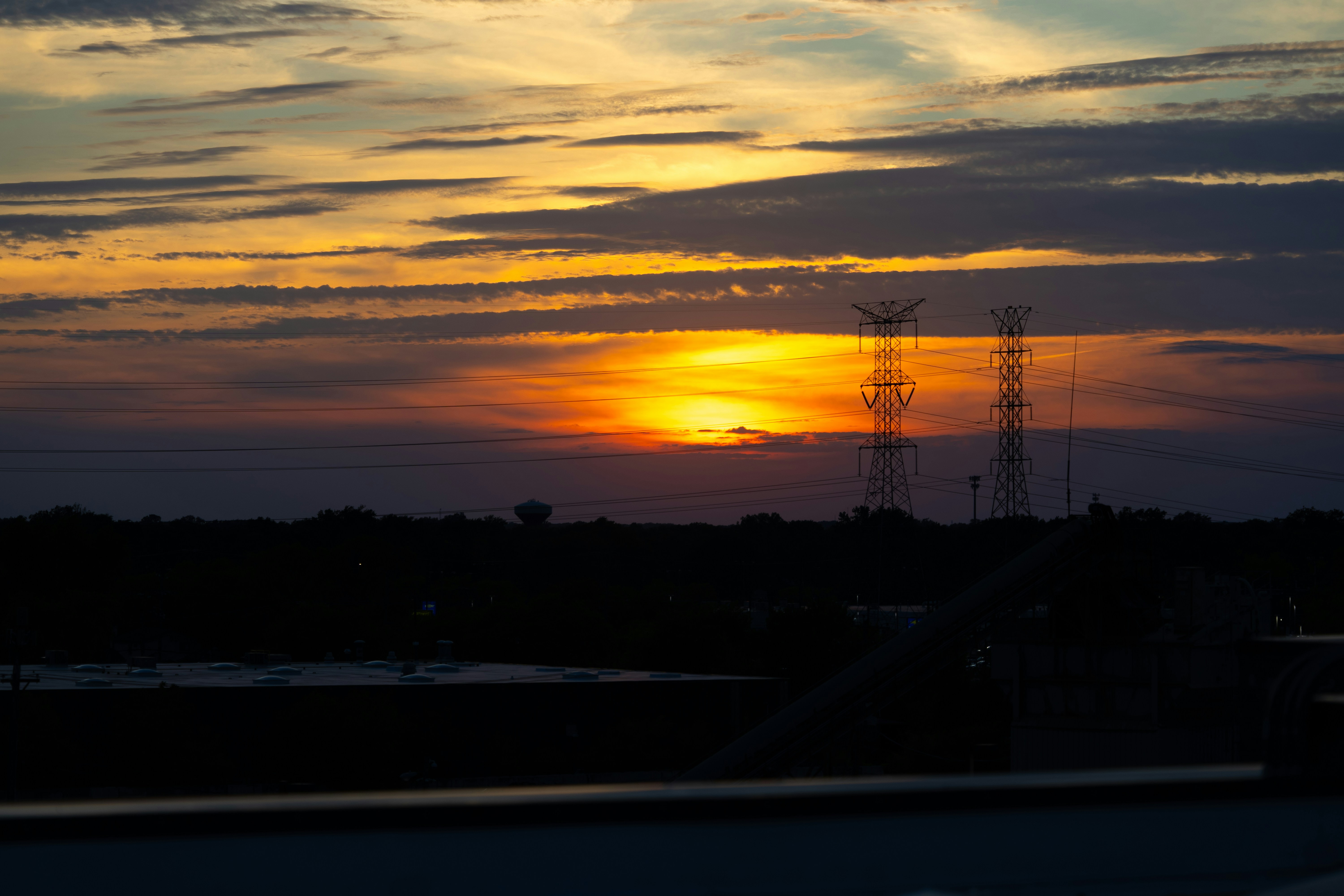 Horizon Burn: Sunset Over Silhouetted Towers