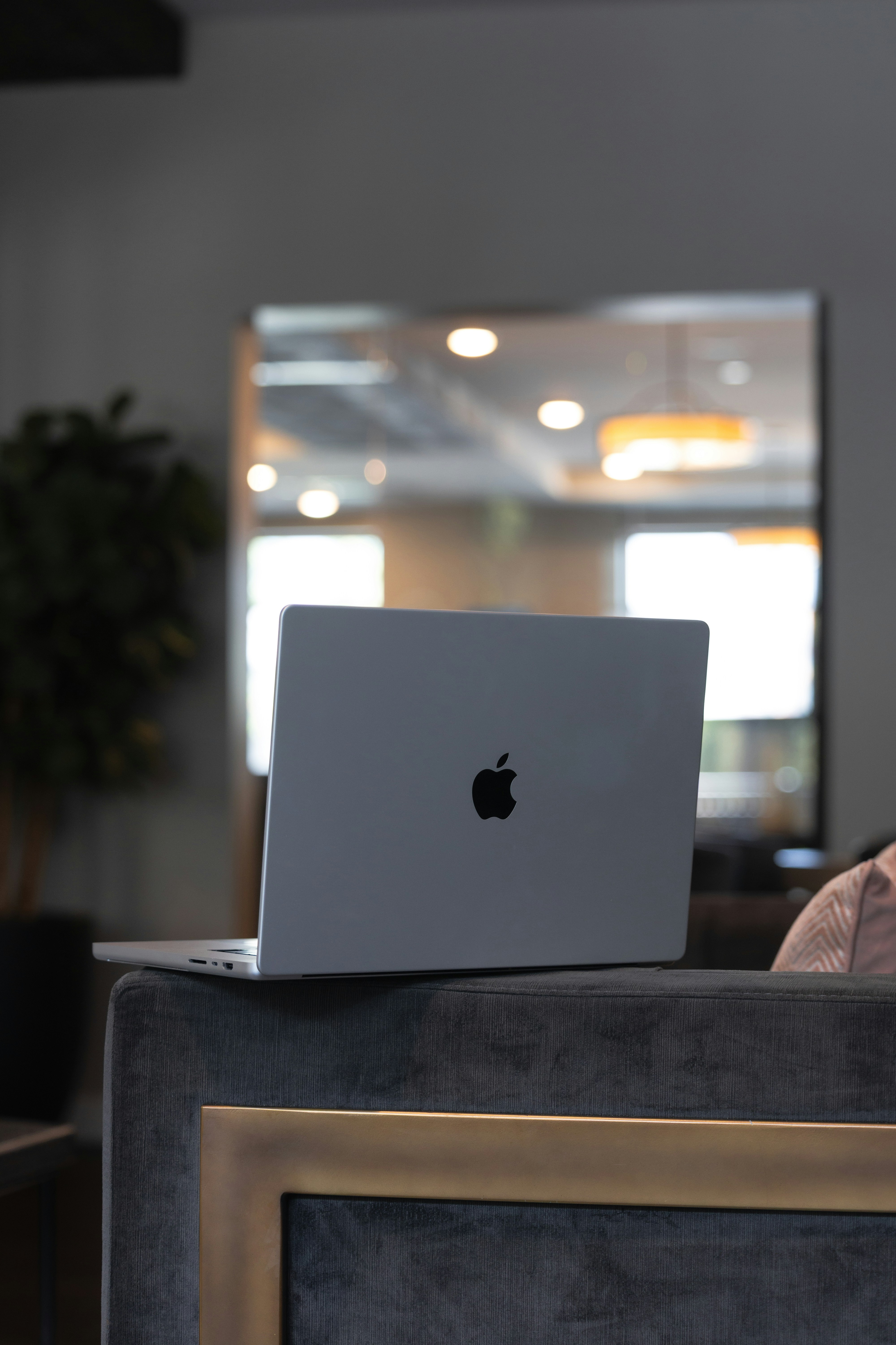 Silent Focus: A MacBook Quietly Anchors a Modern Lounge