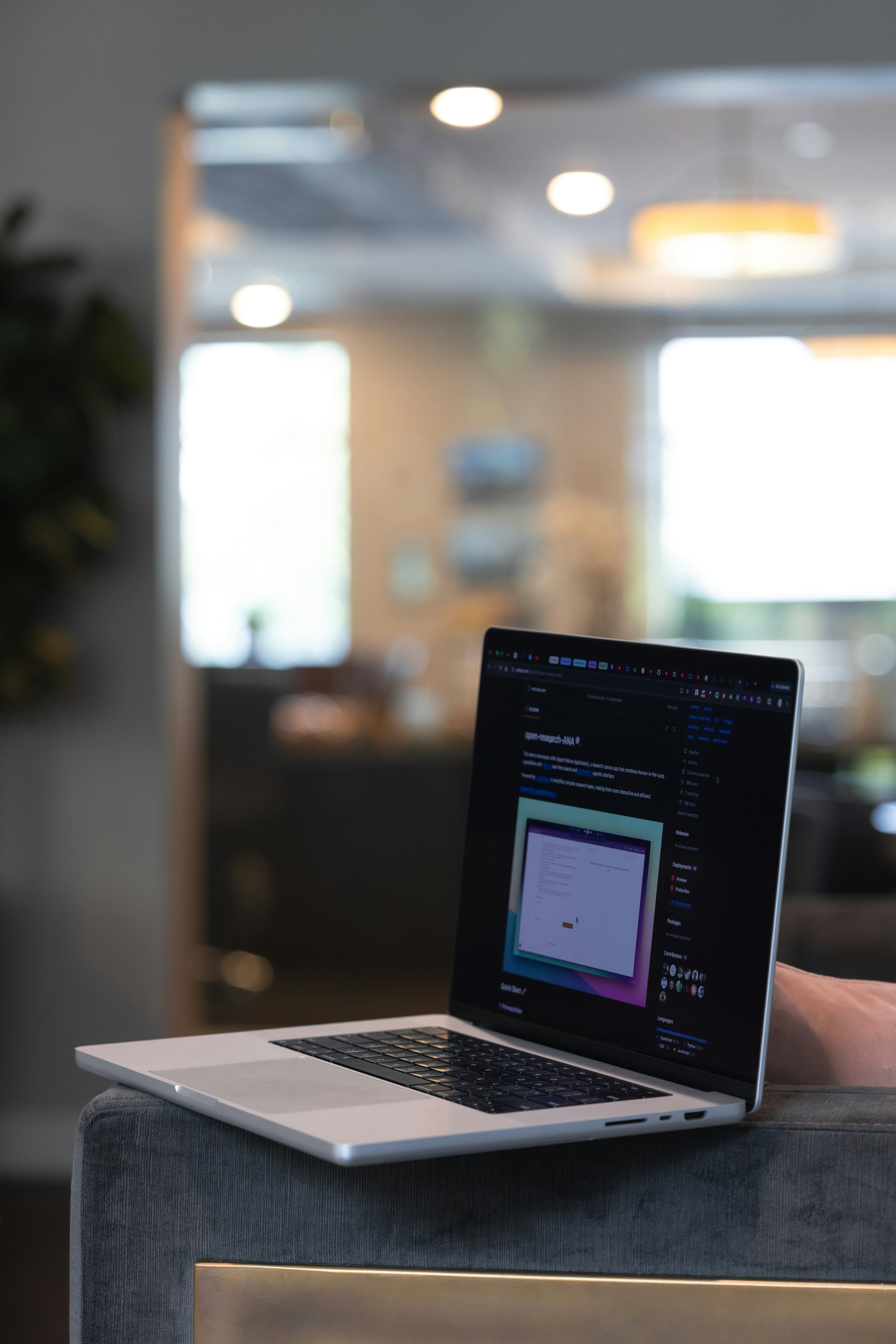 Laptop on a Couch: Quiet Focus in a Modern Office Lounge