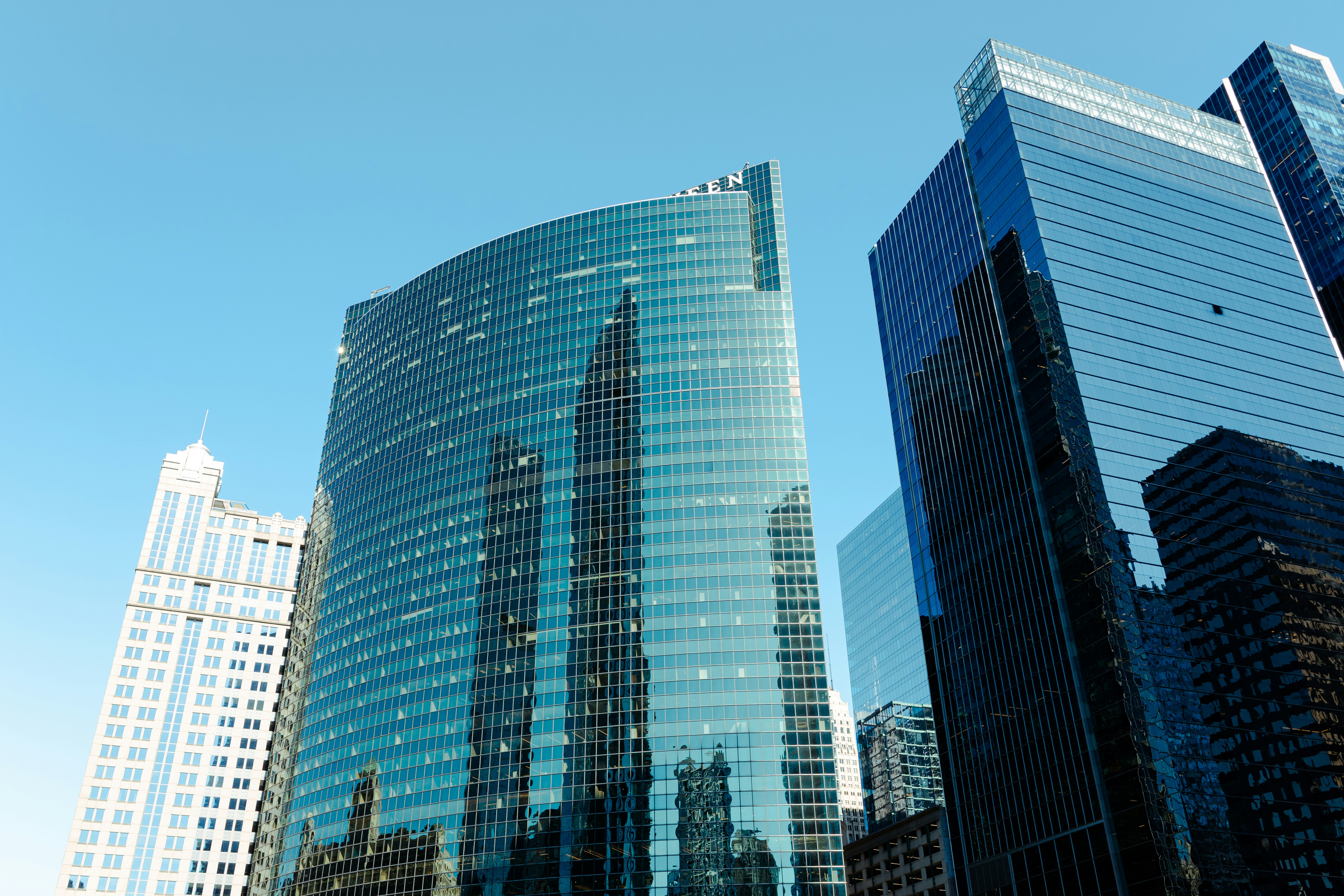 Glass Giants Under a Clear Blue Sky