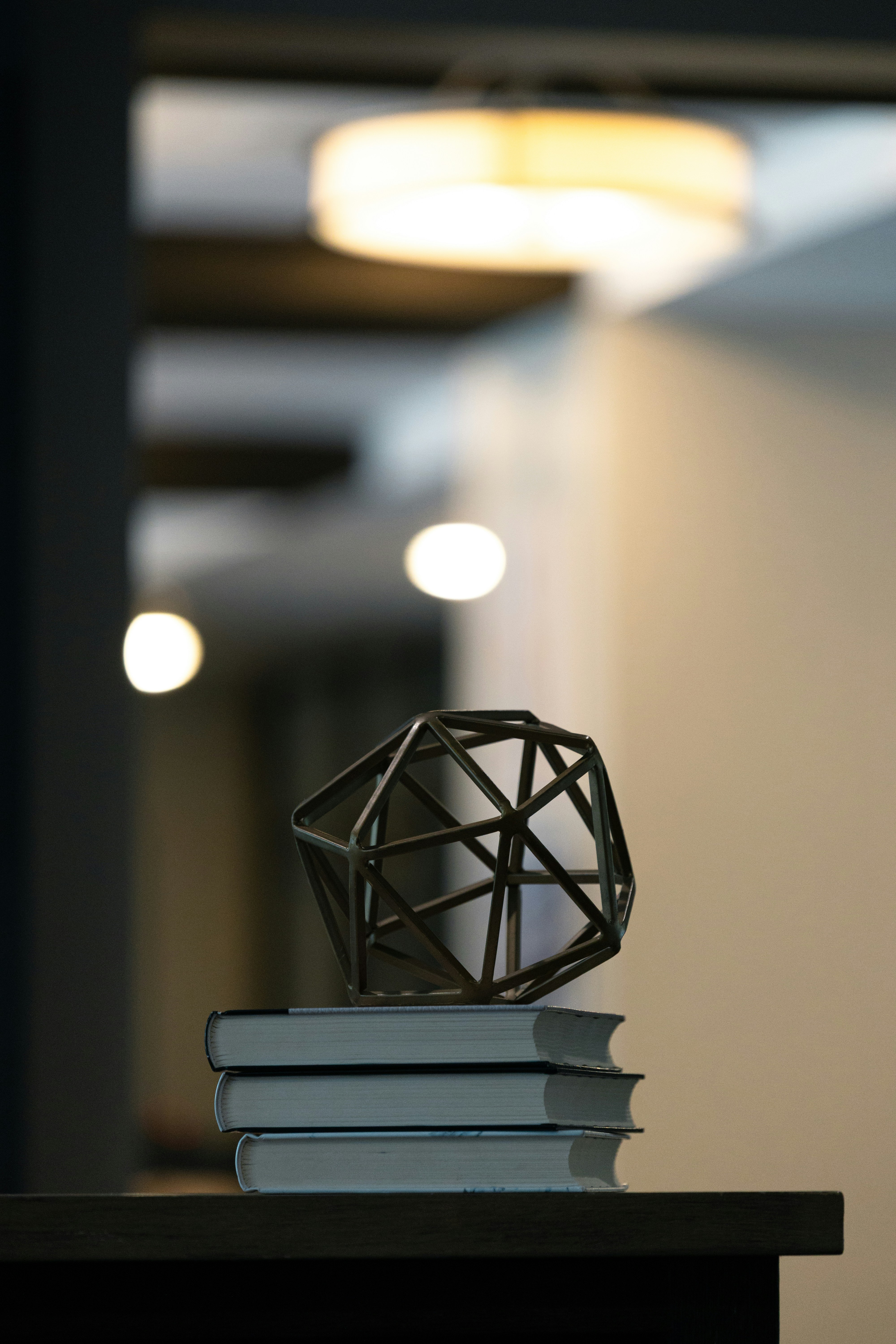 Geometric Balance: A Dark Framework Resting Above Quiet Pages