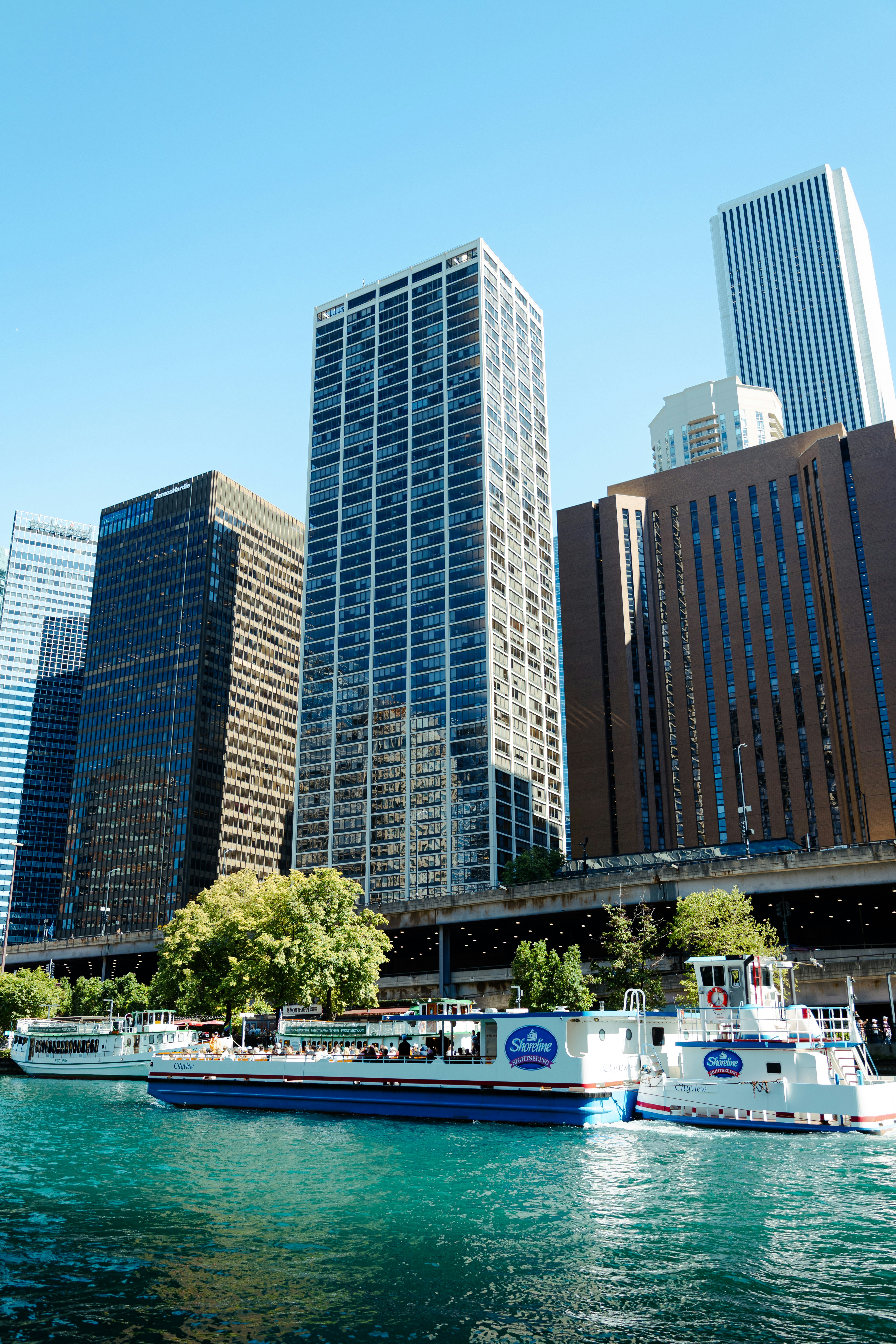 City Waterway Echoes: Skyscrapers Standing Over the Docked Ferry