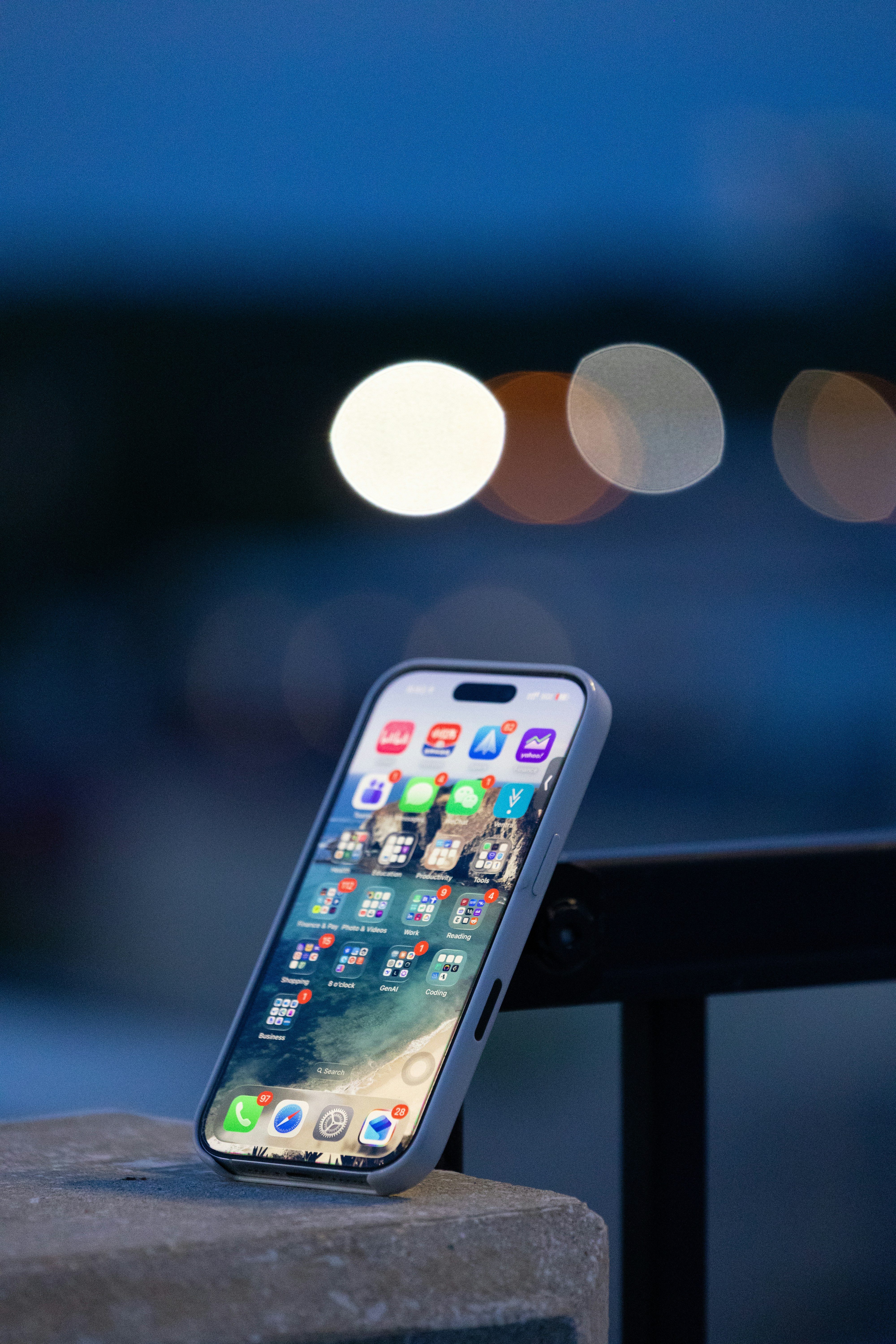 Evening Glow: A Smartphone Quietly Anchored on a Concrete Barrier