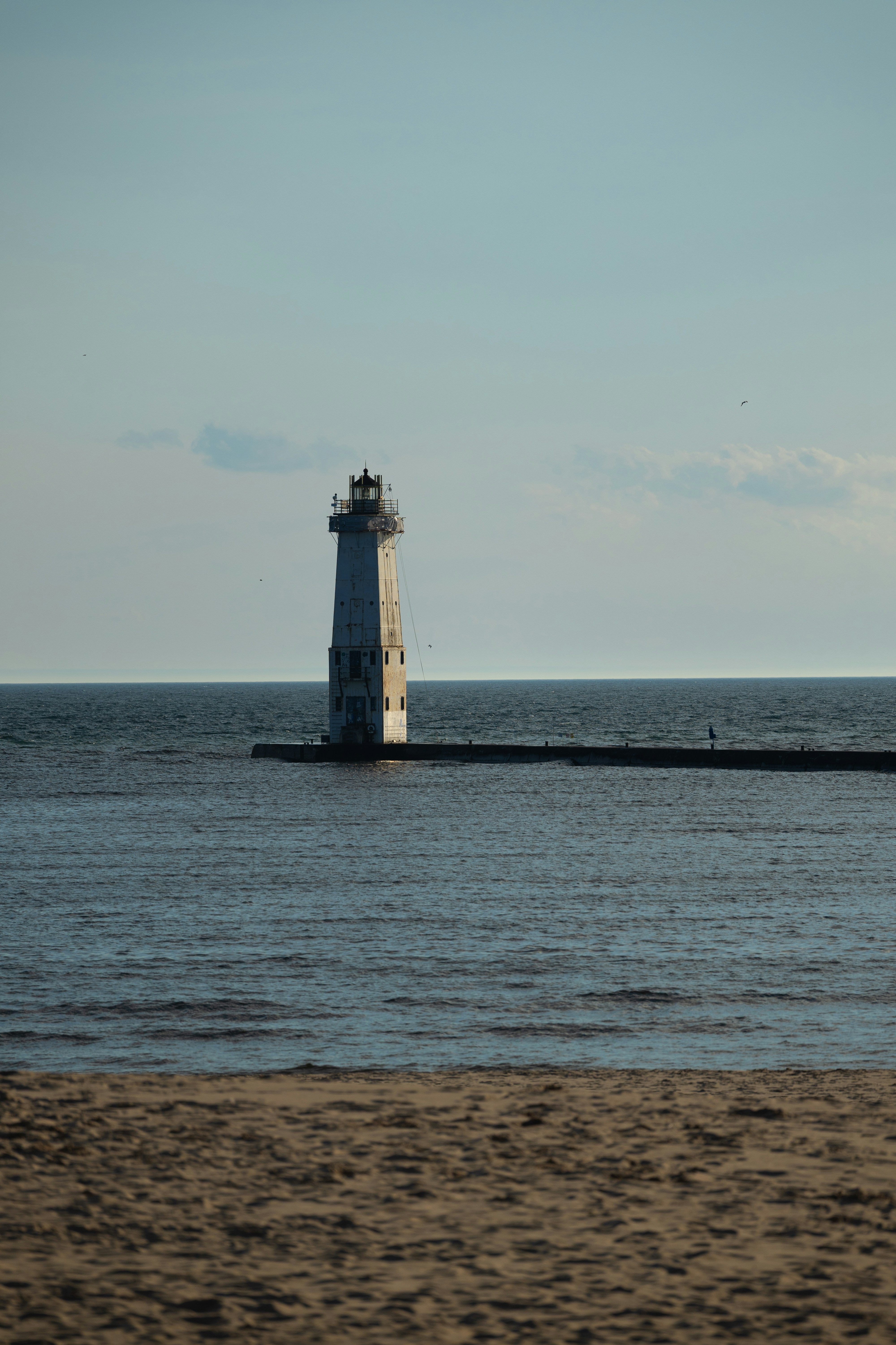 Lighthouse at Sea: Quiet Sentinel Beyond the Breakwater