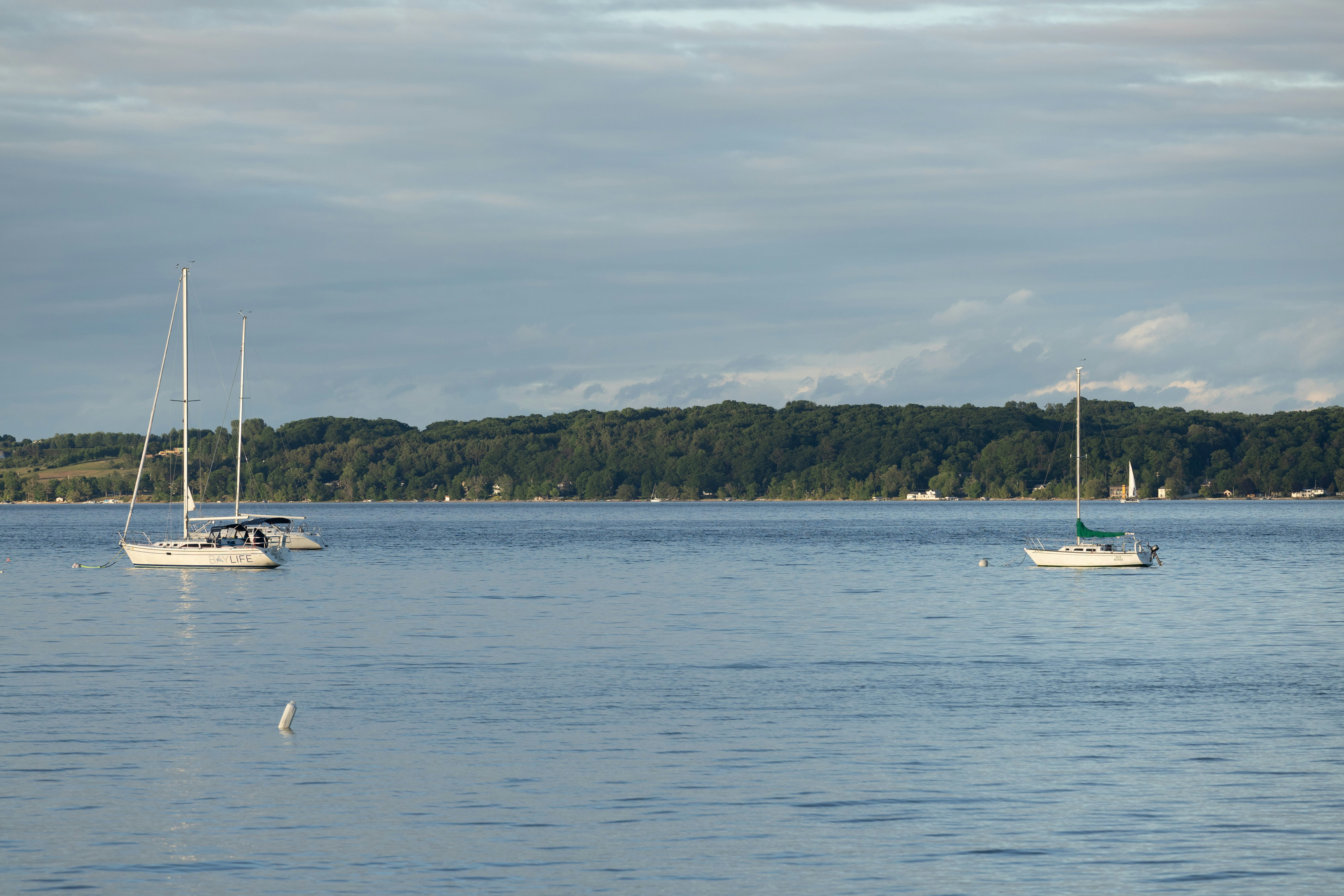 Calm Coastal Dunes: Sails at Dusk