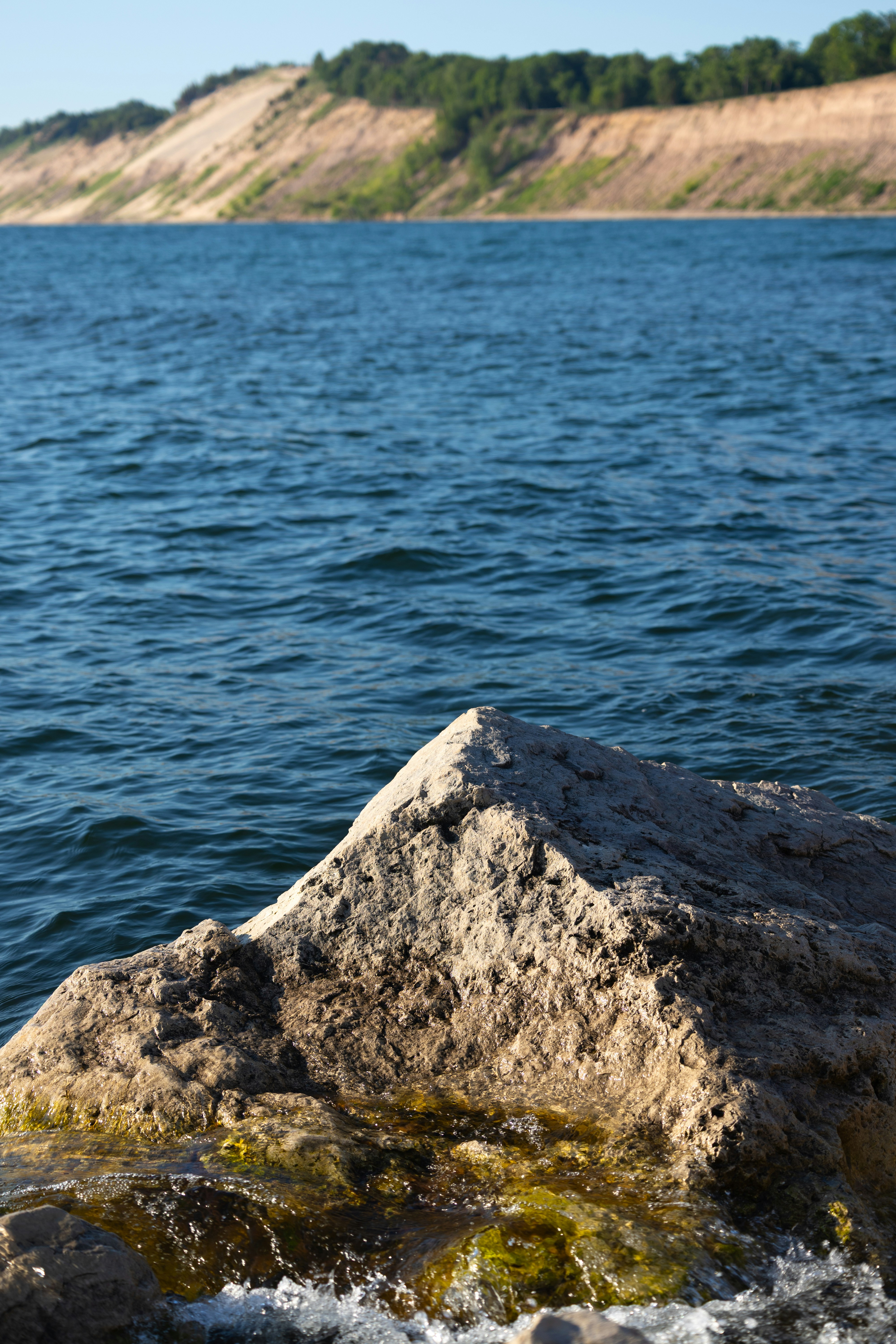 Rugged shoreline meeting a calm blue expanse