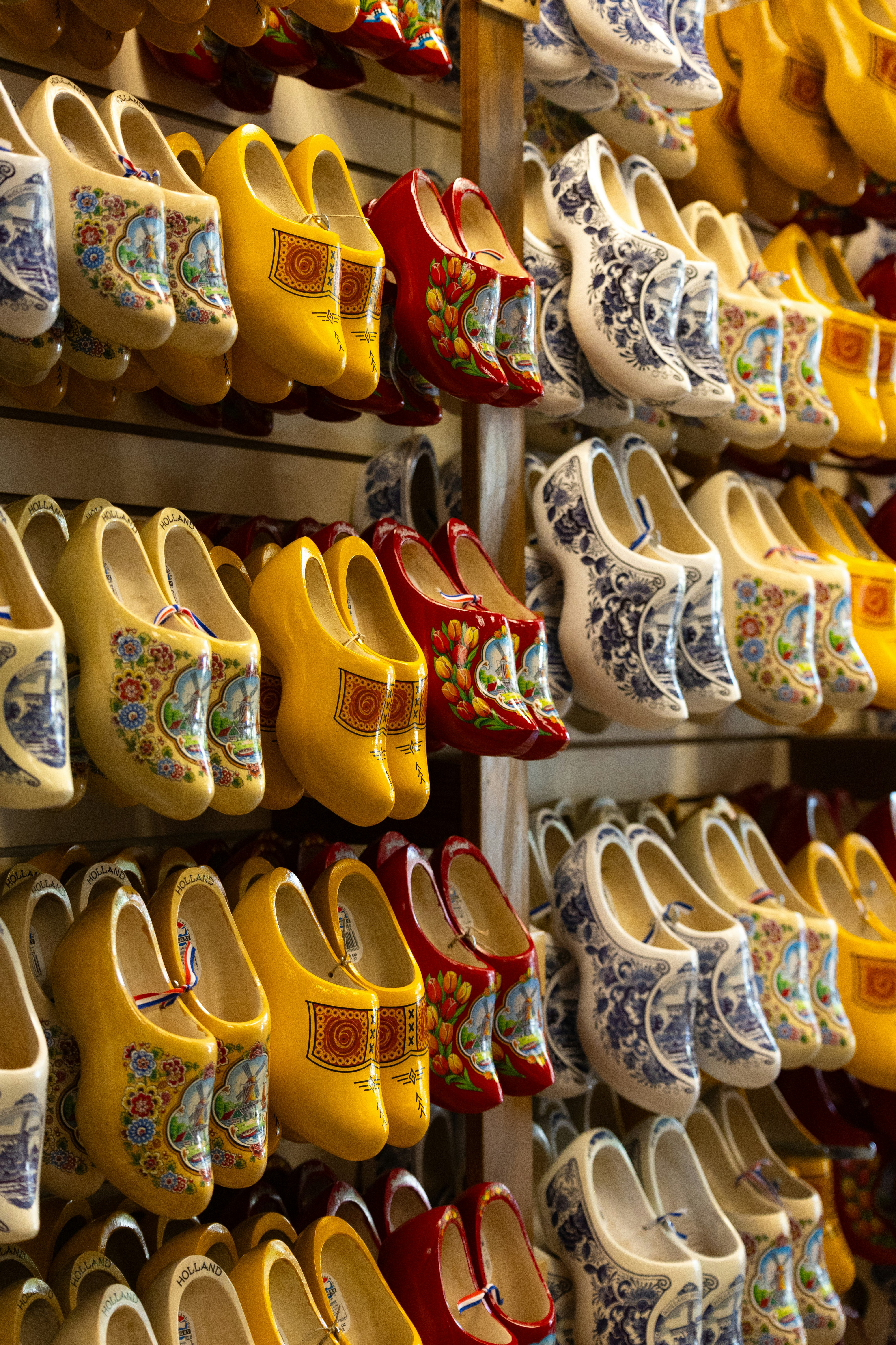 A Wall of Colorful Clogs: Yellow, Red, and Blue in Repeating Rows