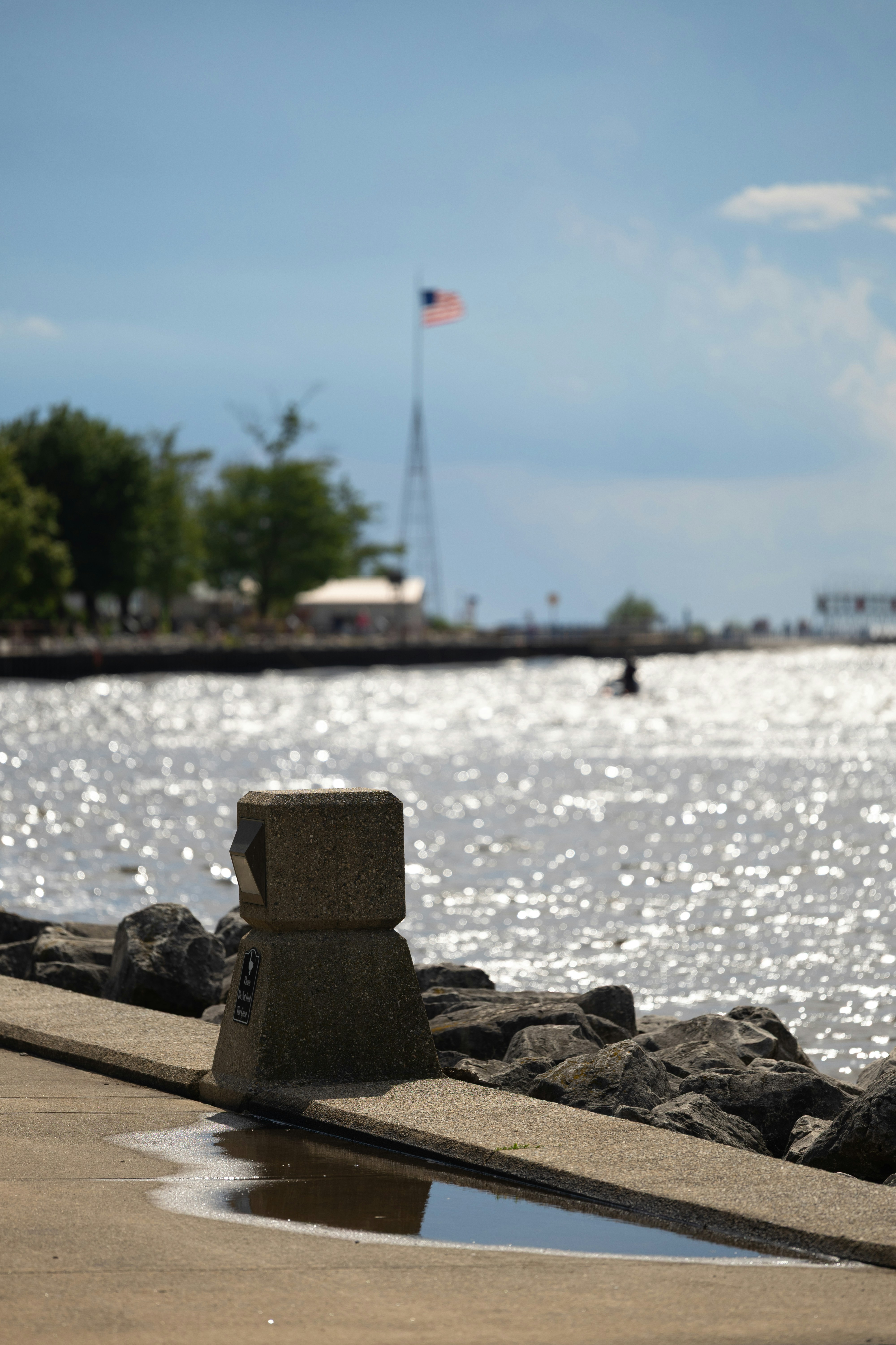 Concrete Breakwaters and Glimmering Gulf: Calm Linear Perspective by the Pier