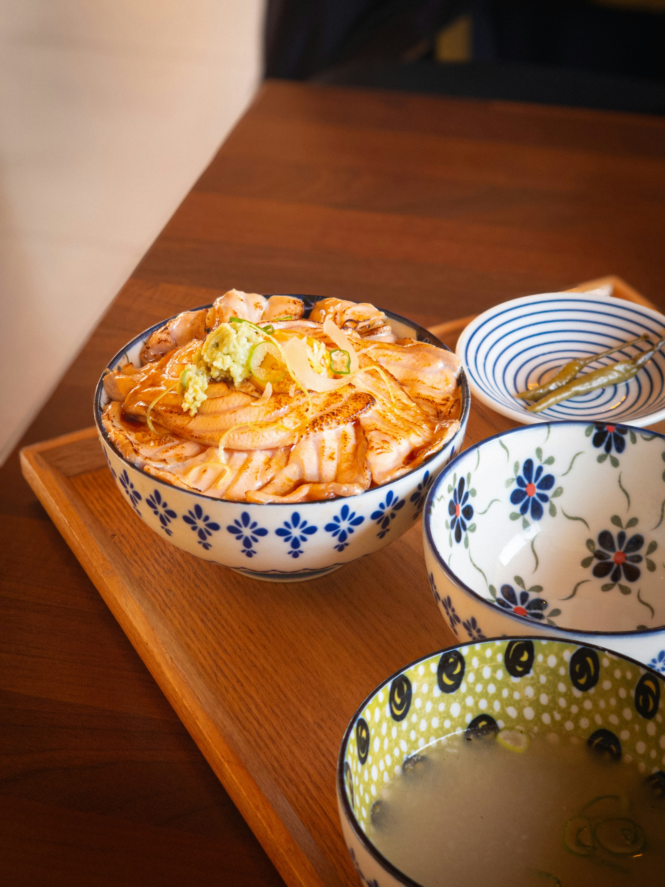 Crimson Salmon Symphony: A Bowls-full of Nigiri on a Wooden Tray
