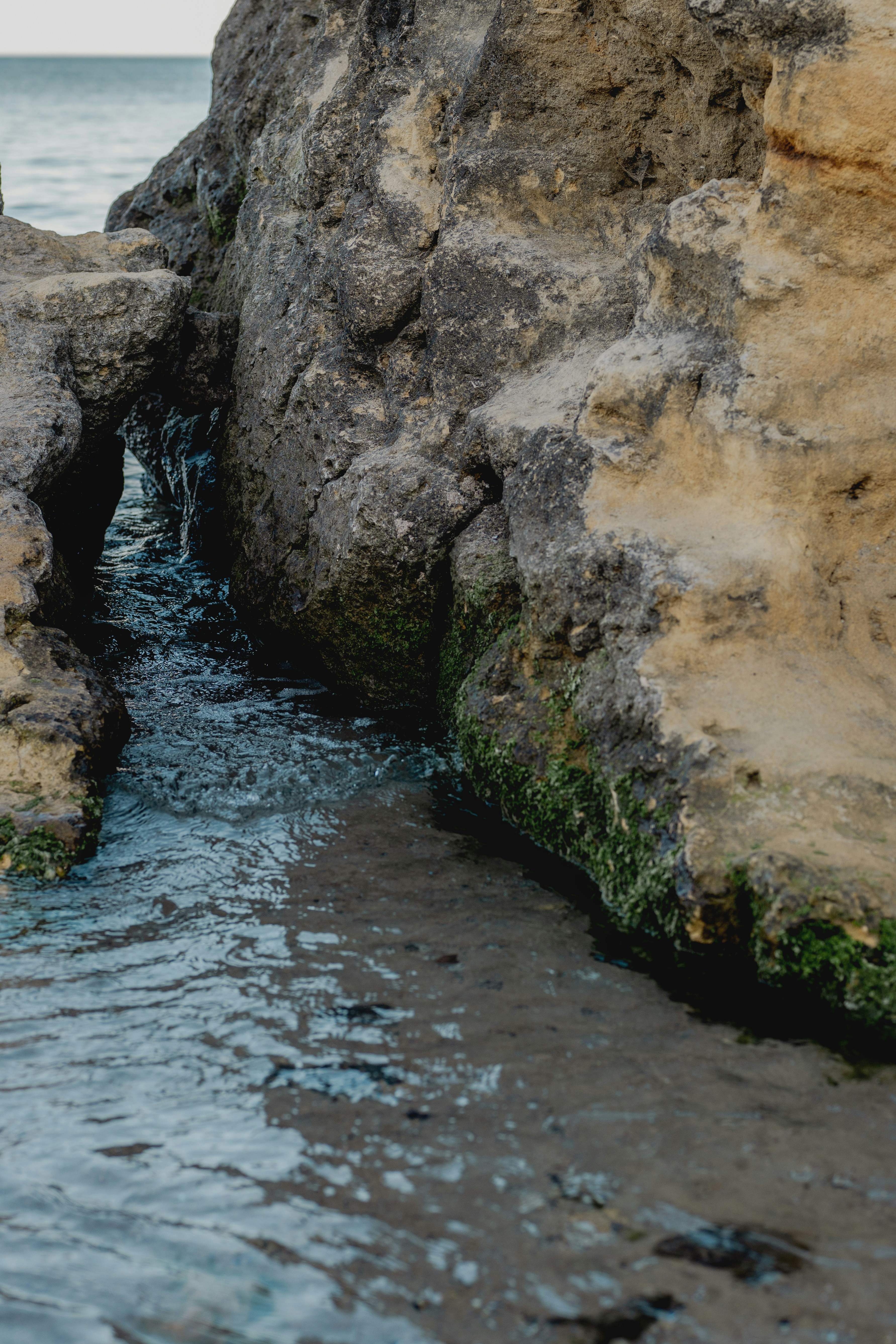 Hidden Channel Between Weathered Cliffs