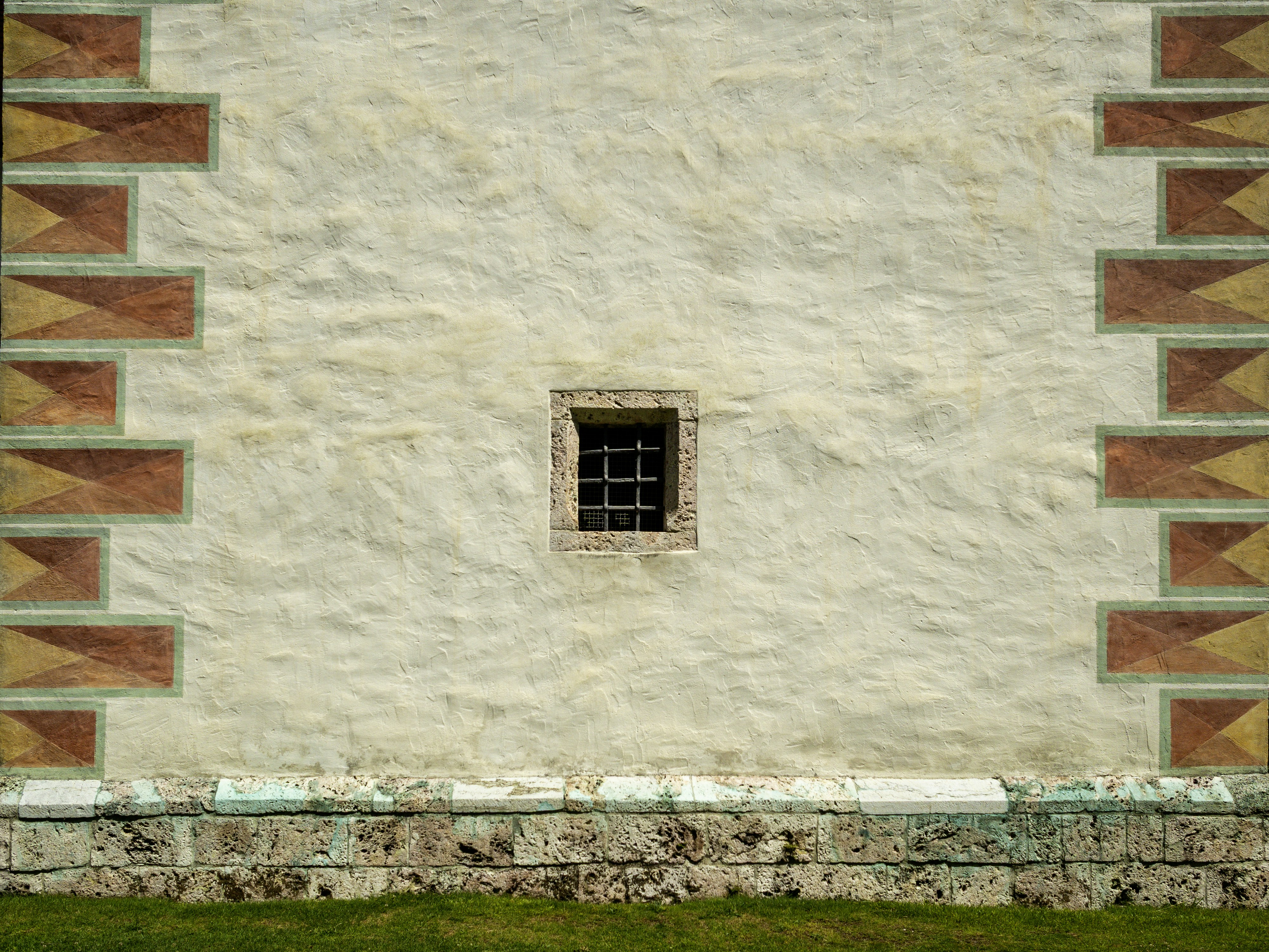 Hidden Window on a Stucco Wall: Symmetry and Subtle Texture