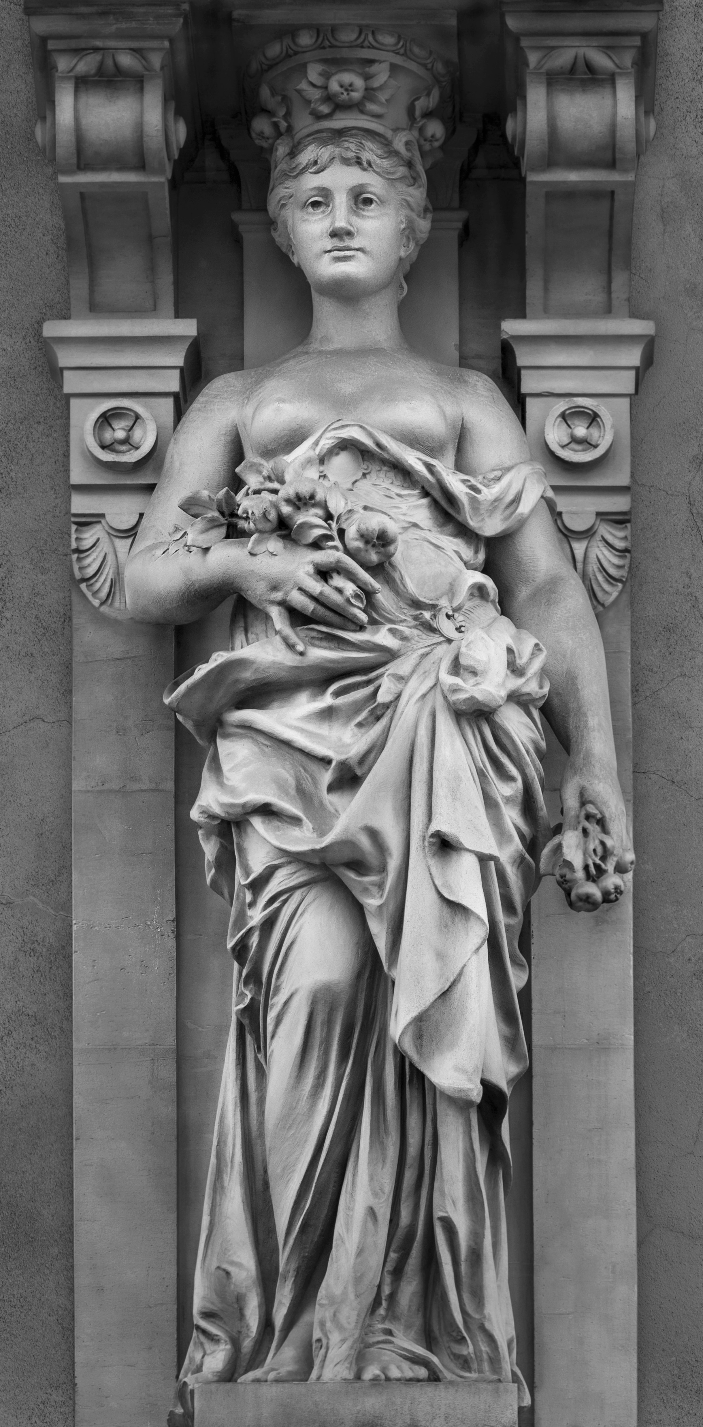 Stone Queen: A Sculpted Figure in Monumental Arch