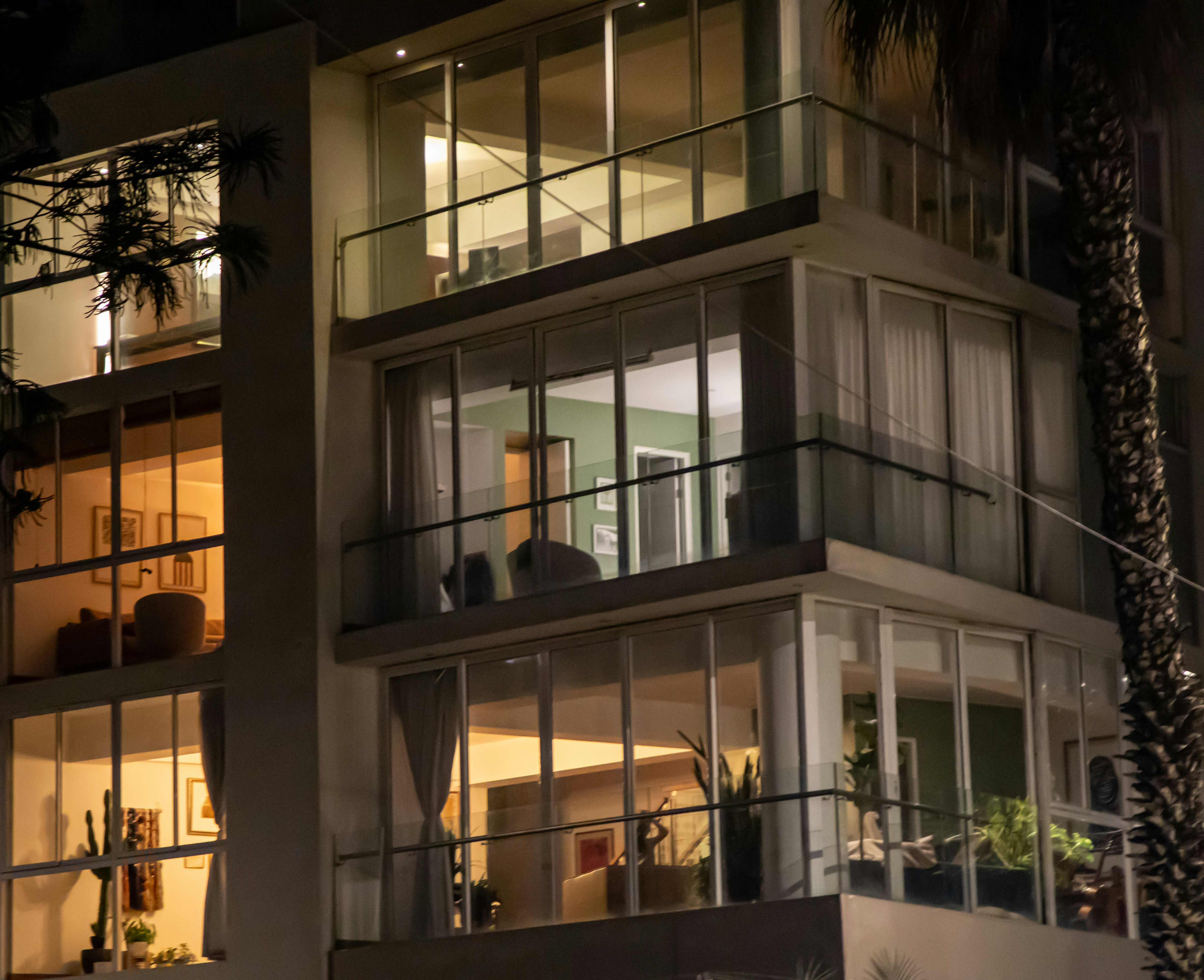 Nighttime Apartment Glow: A Vertical Stack of Quiet Living Spaces