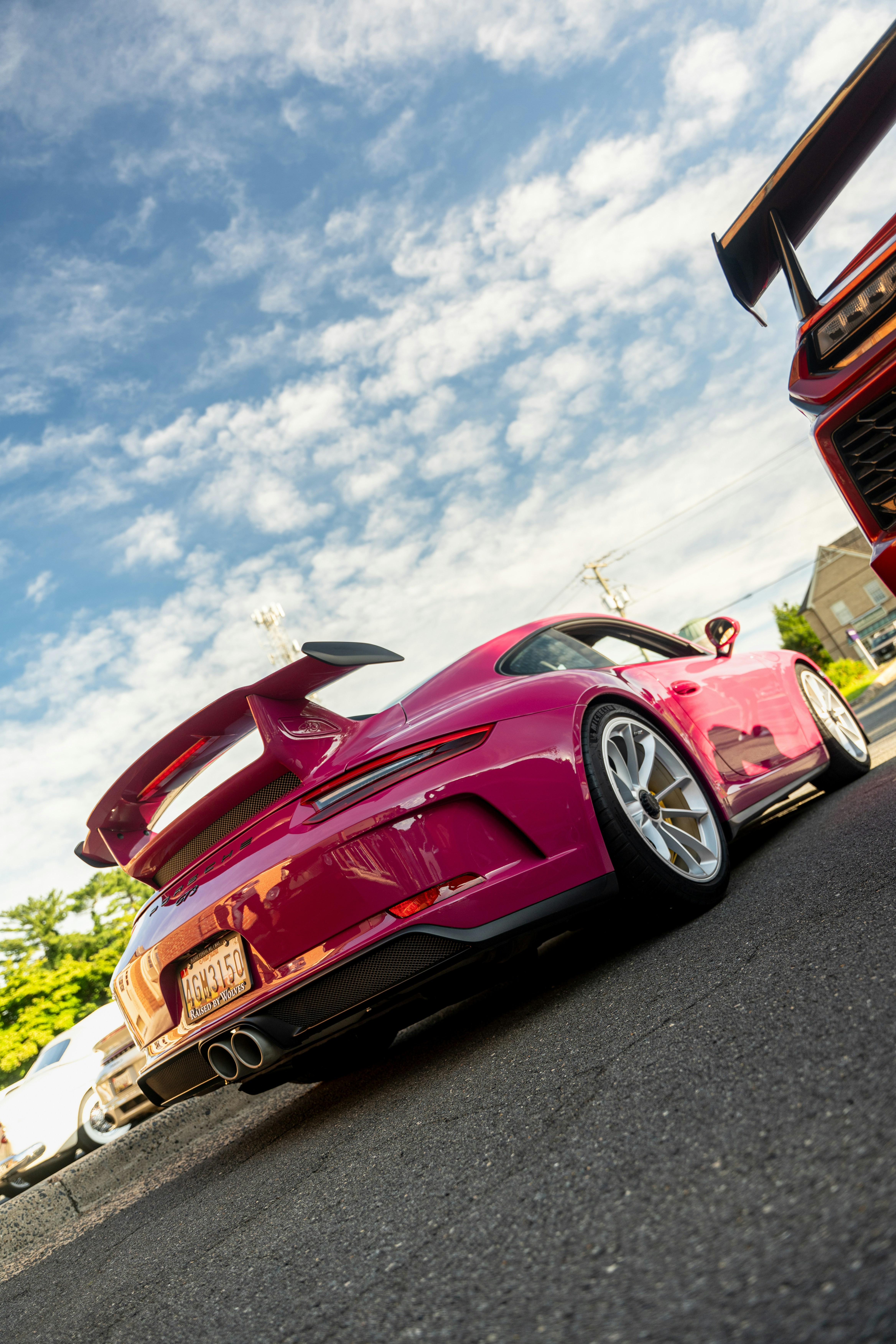Pink Supercar Under a V-Shaped Sky