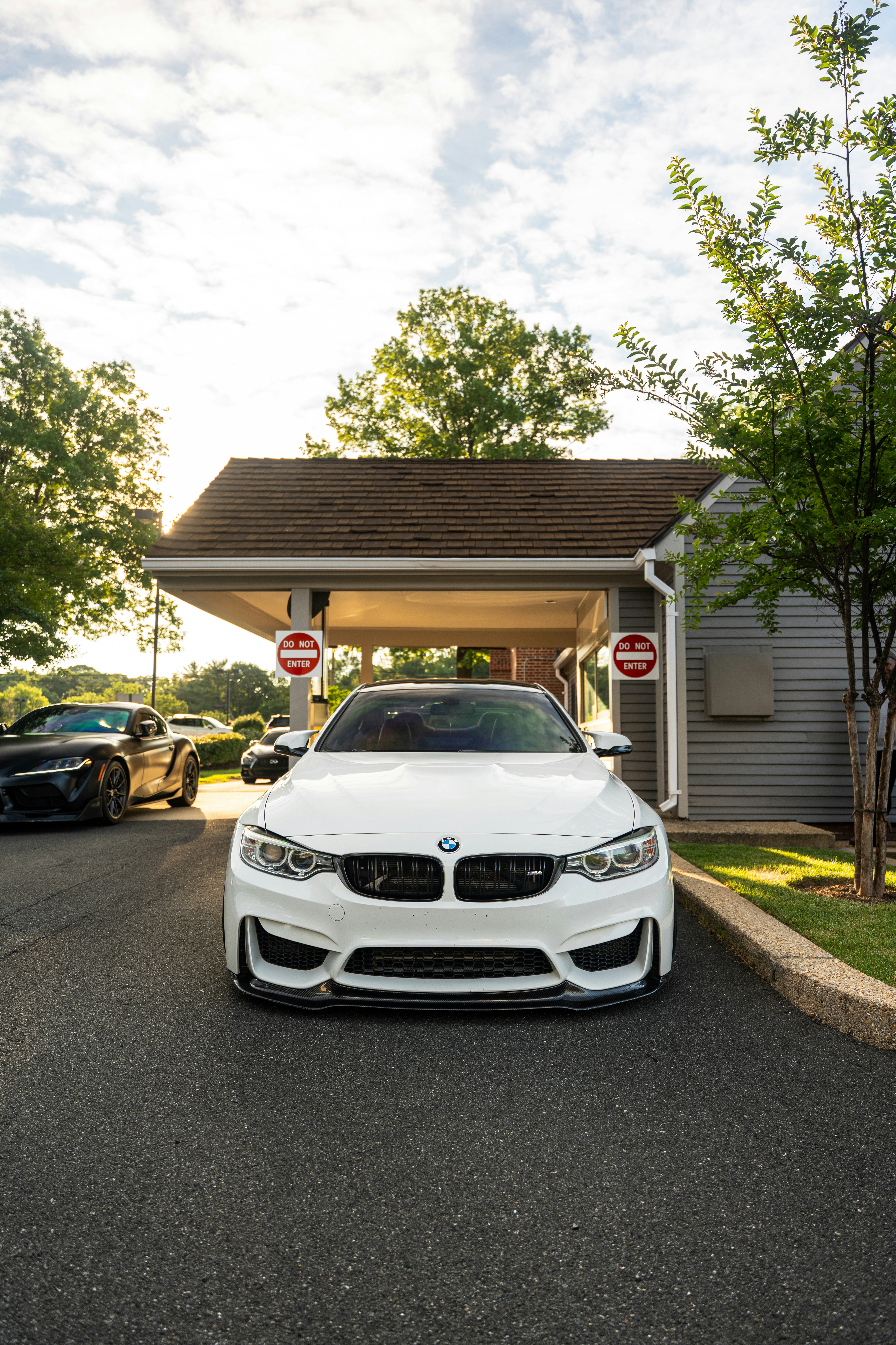 White BMW at the Carport: A Quiet Driveout