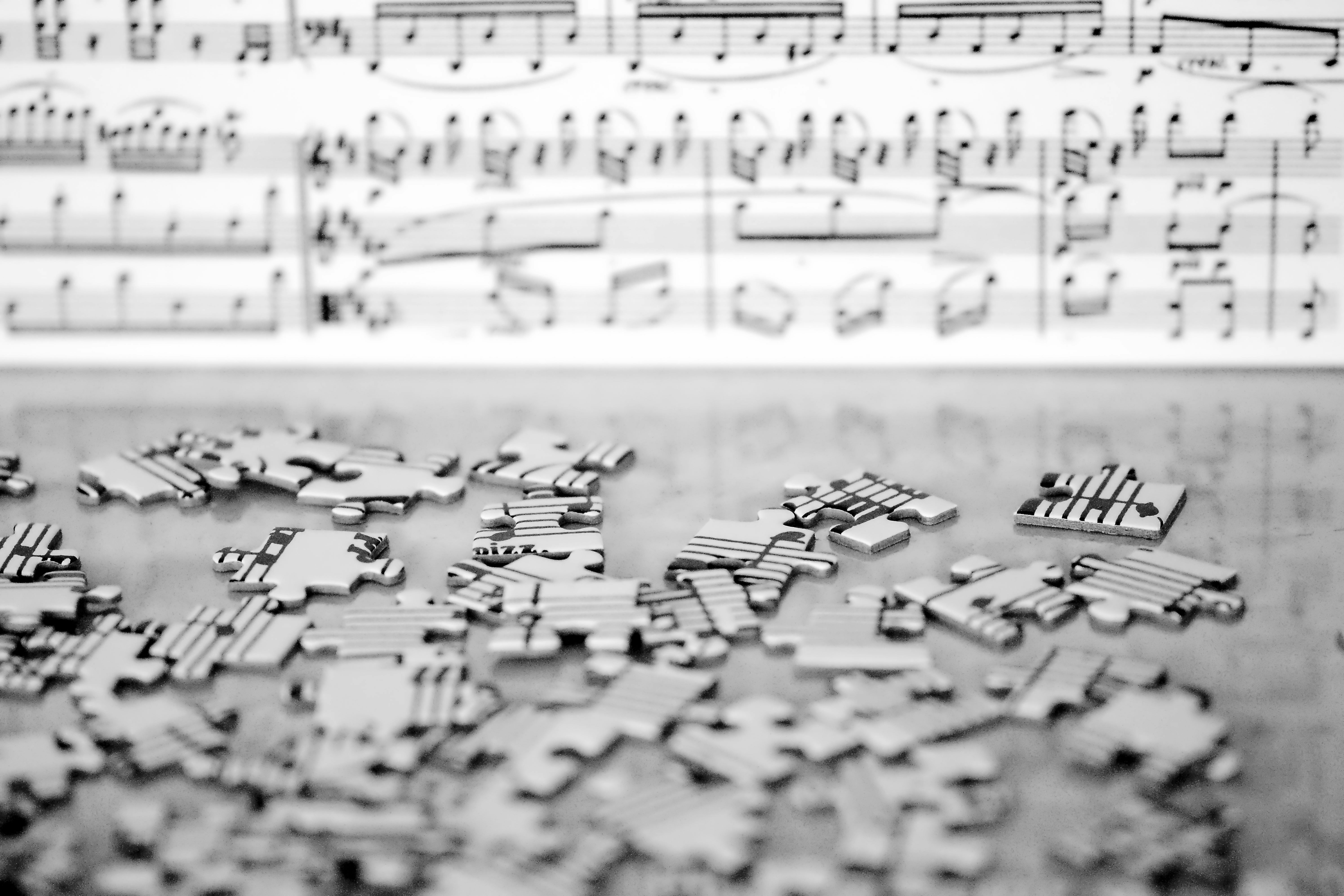 Chiaroscuro of Sound: Scattered Notes with Musical Score in the Background