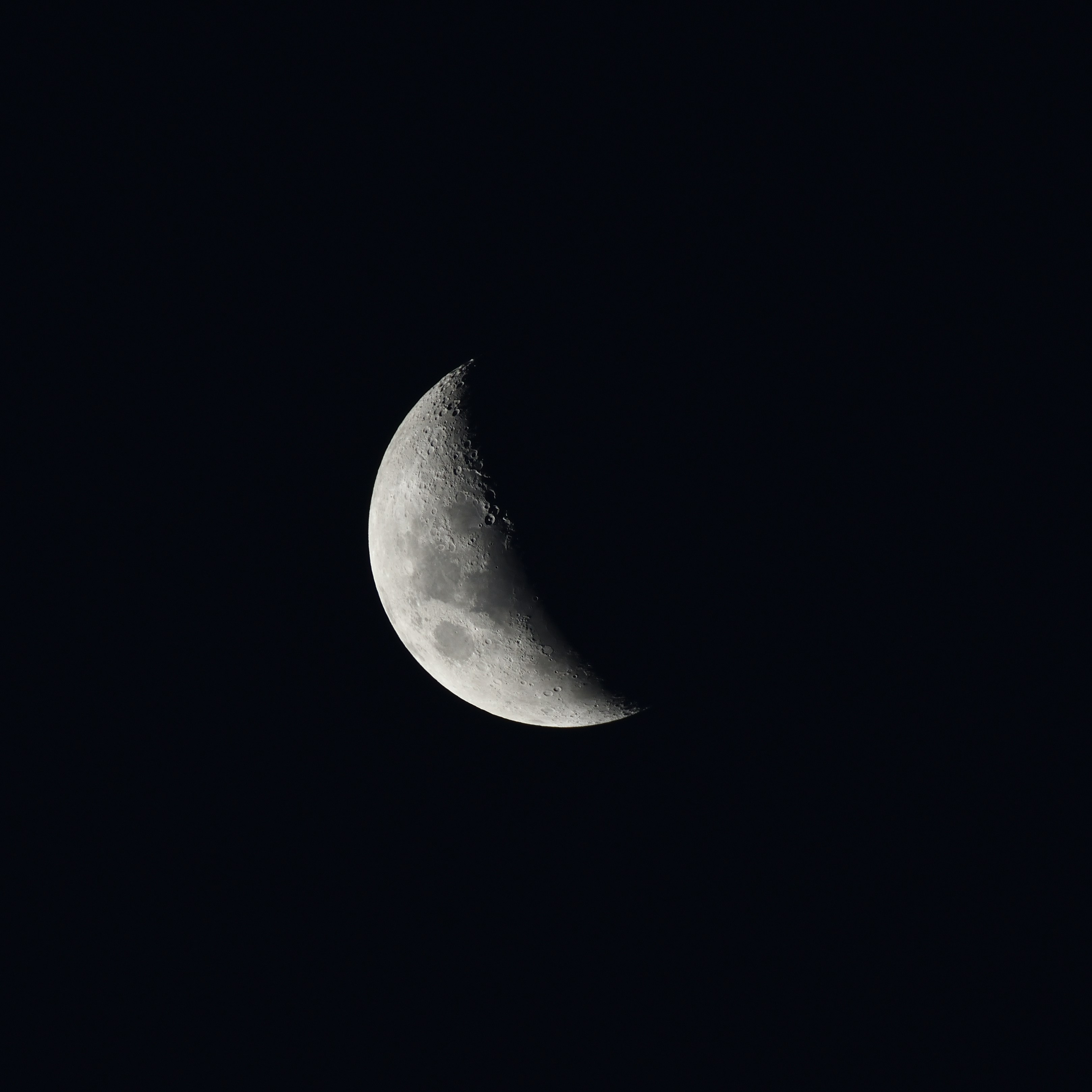 Lunar Crescent in Quiet Night: A Minimal Portrait of Moonlit Texture