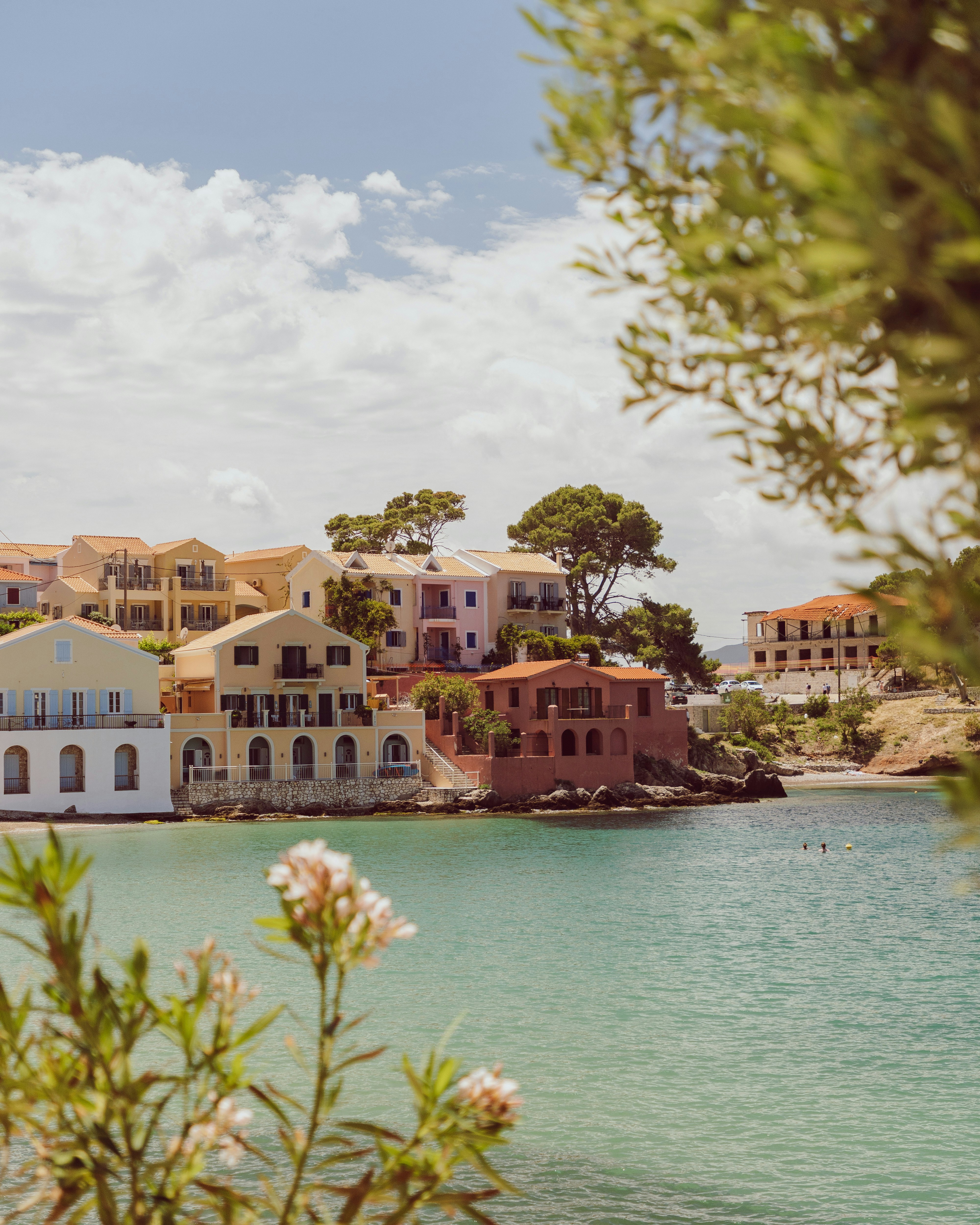 Sunlit Lagoon Village: A Quiet Coastal Row of Colorful Homes
