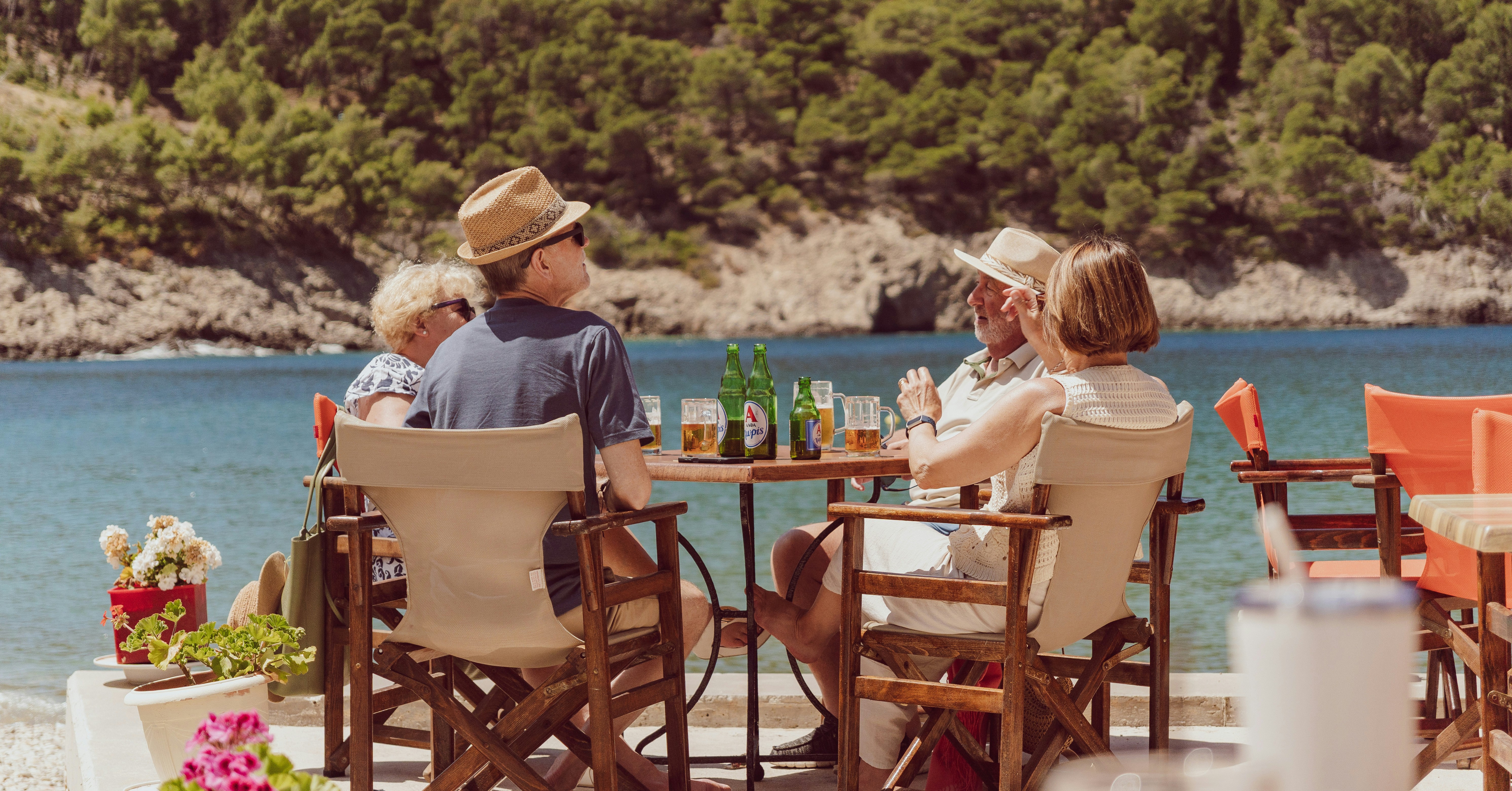 Seaside Terrace: Conversation Over Cocktails and Sunlit Scenes