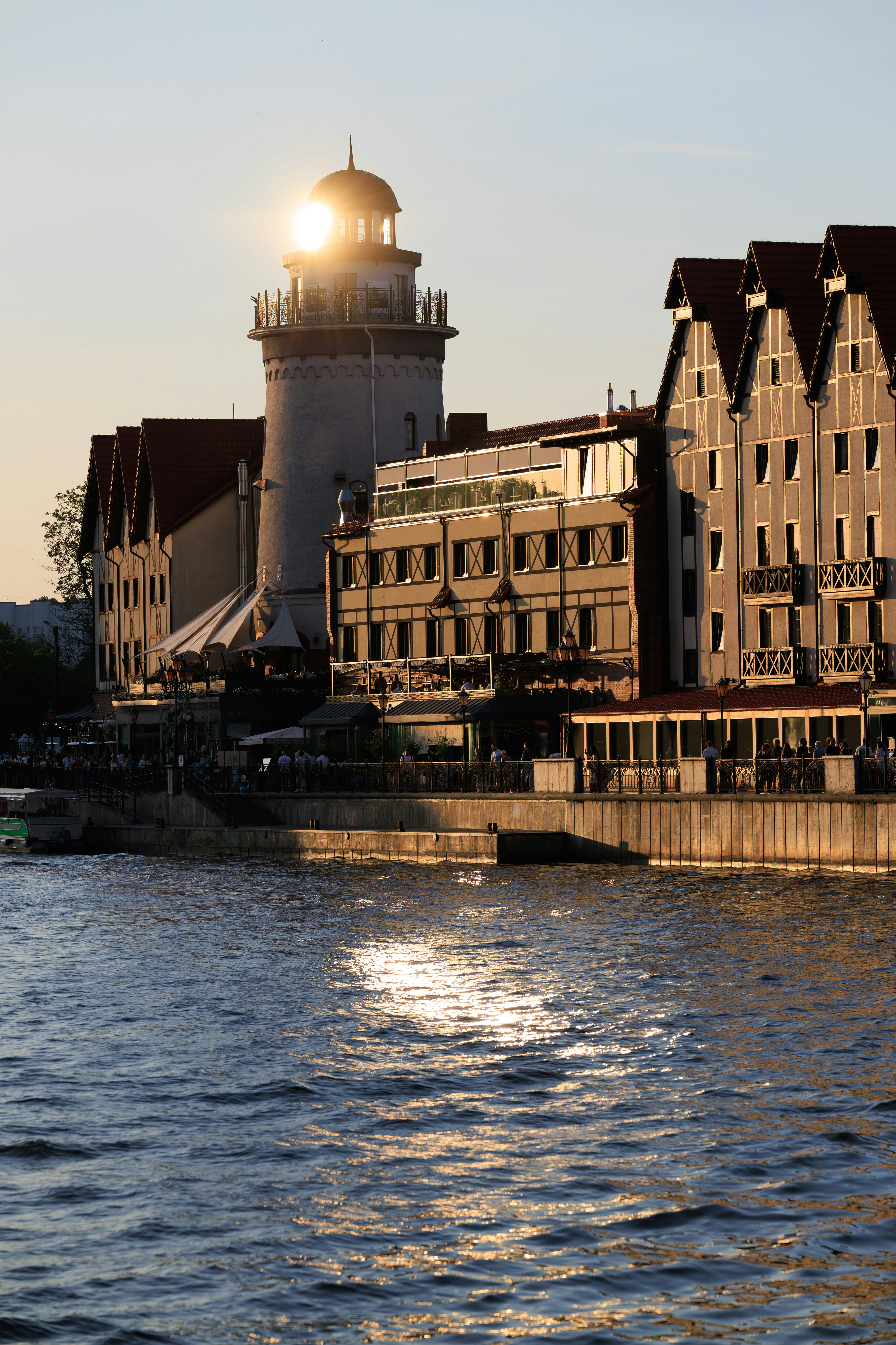 Harbor Whim: The Lighthouse Dawn Over Riverside Warehouses