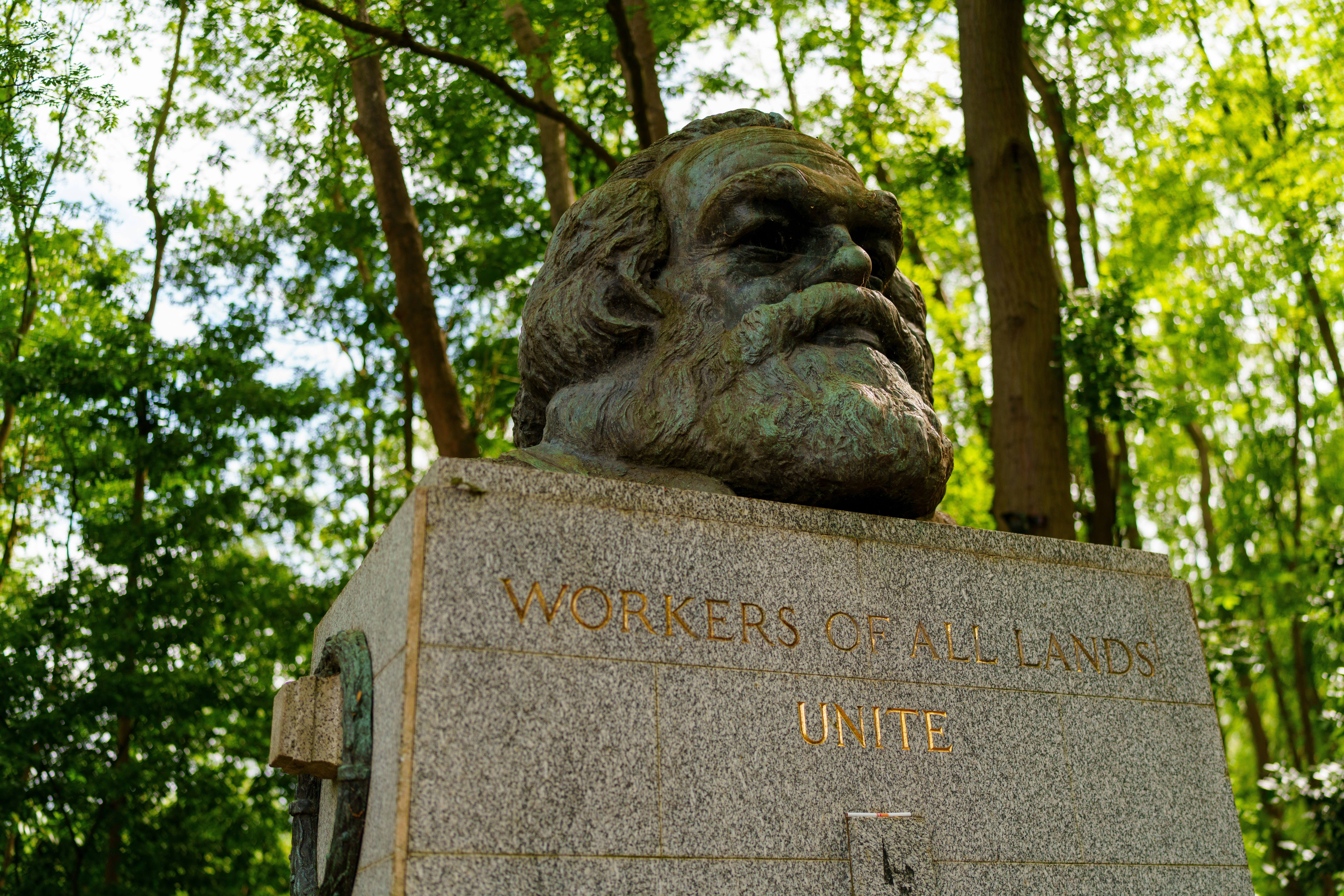 Head of Unity: Monument Bust Rising from Granite Pedestal